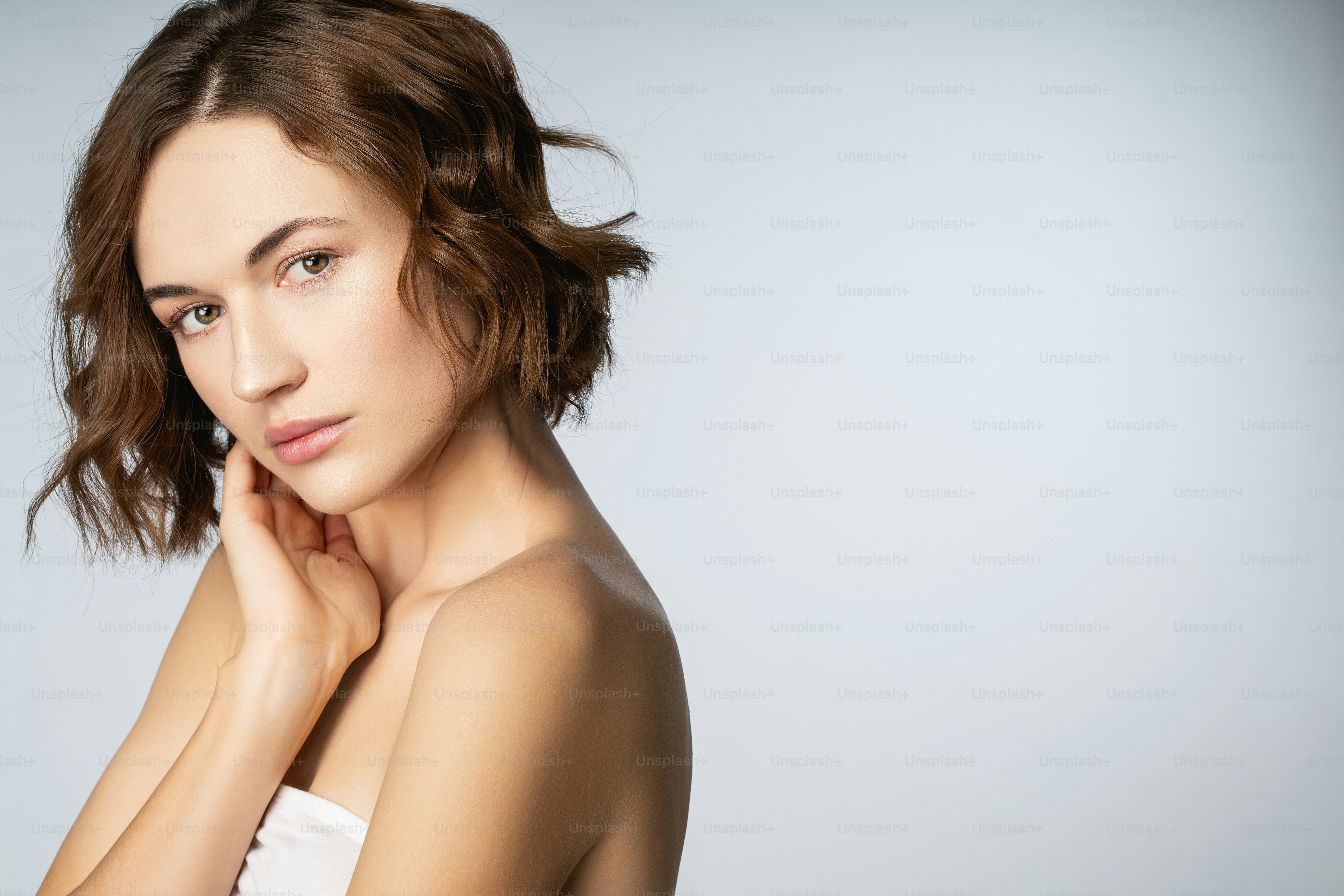 Studio shooting. Attractive young female person standing isolated on ...