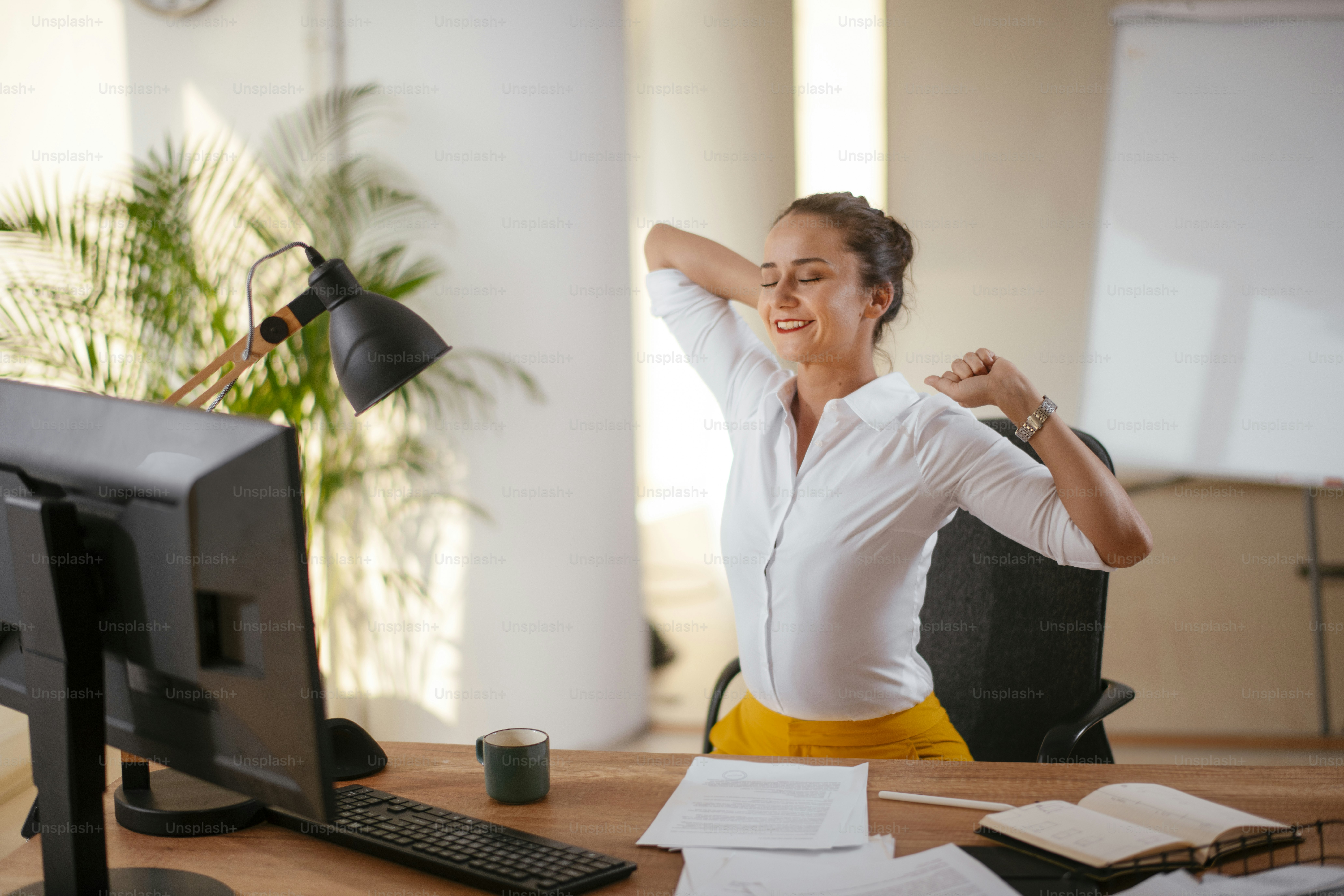 Businesswoman working. Beautiful young woman working in office. photo ...