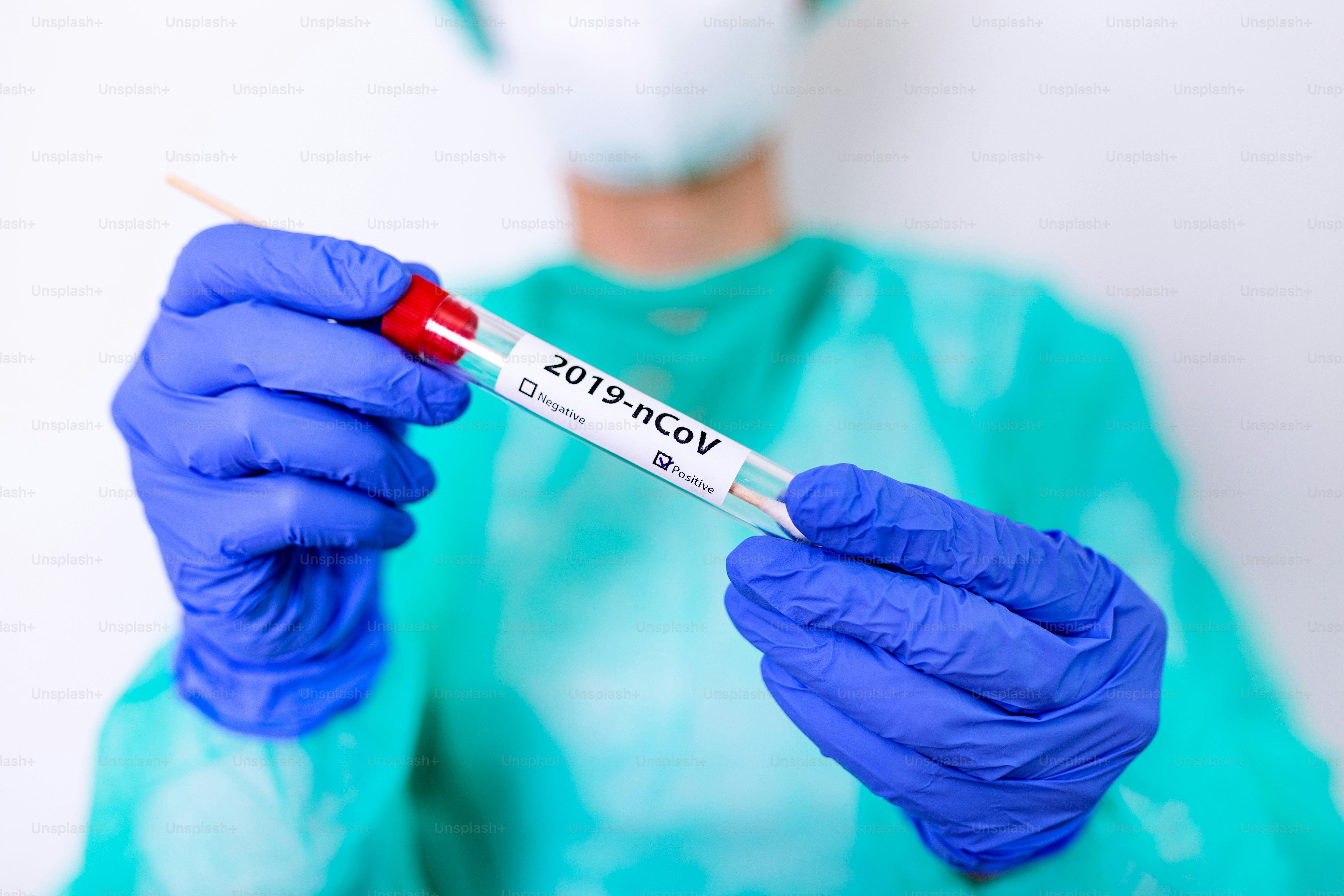 COVID-19 Nasal swab laboratory test in hospital lab, Nurse holding test ...