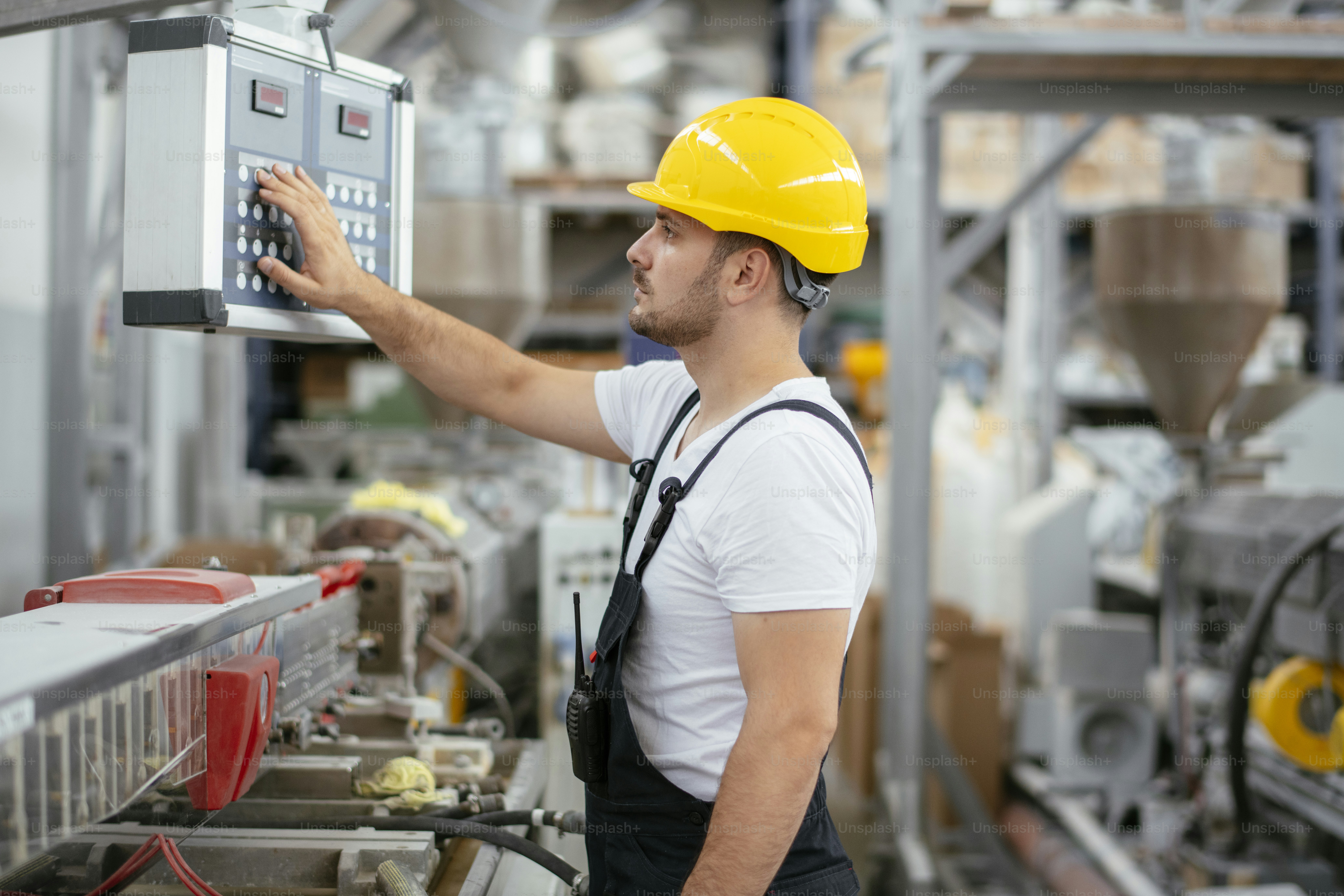Portrait of factory worker. Young handsome factory worker. photo ...