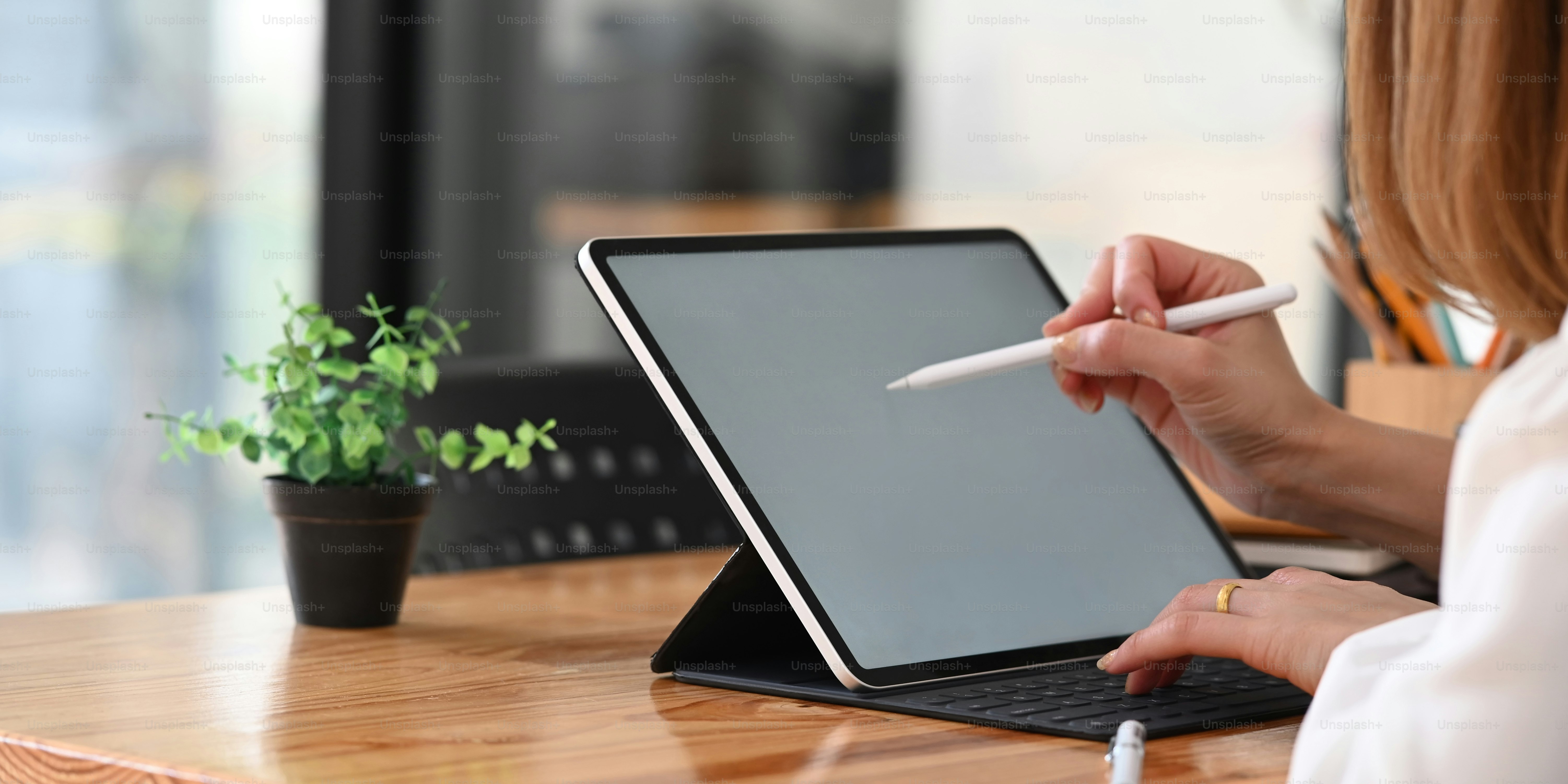 Photo of stylist woman designing a new project by using a stylus pen ...