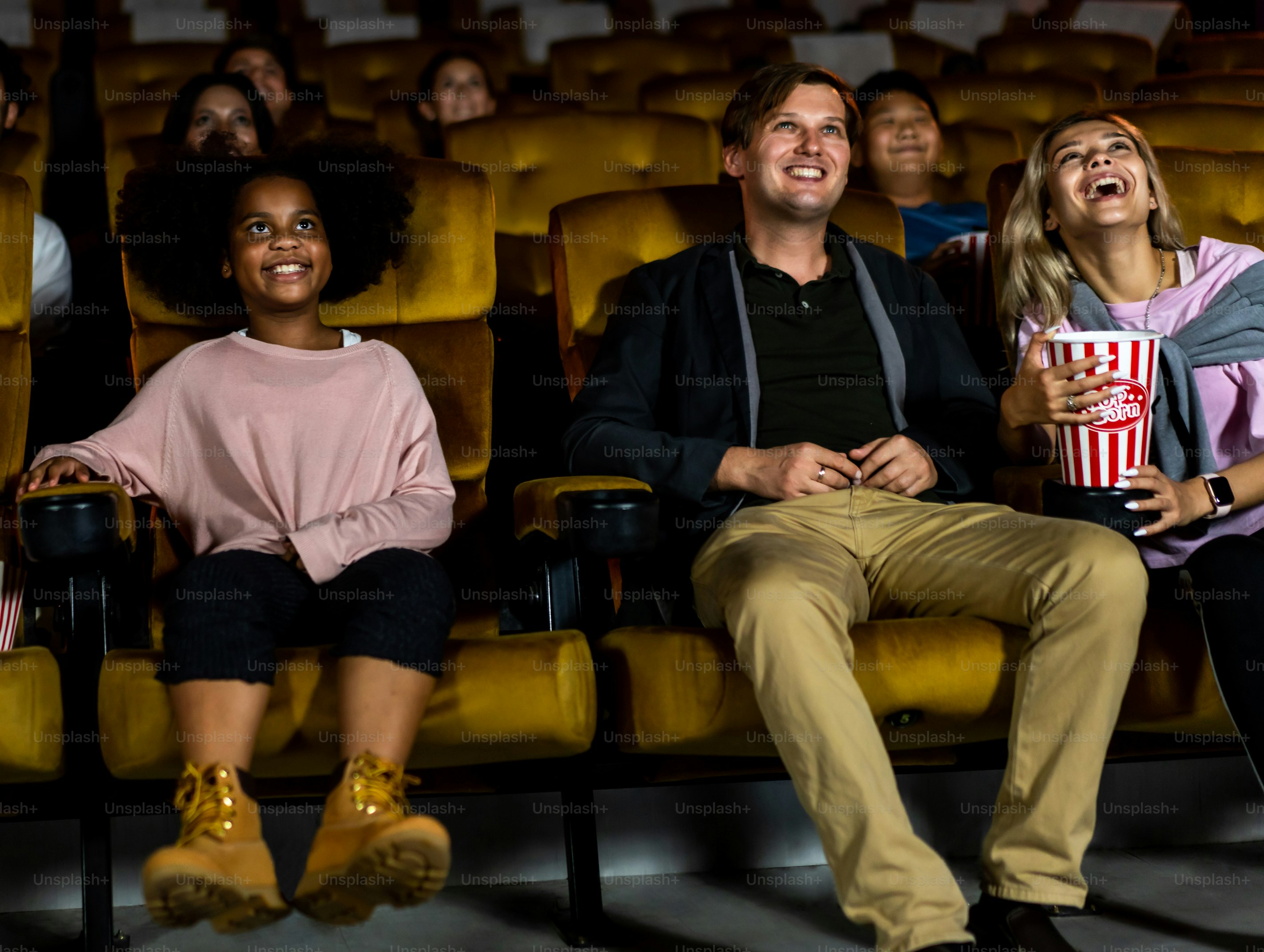 People audience watching movie in the movie theater cinema. Group ...