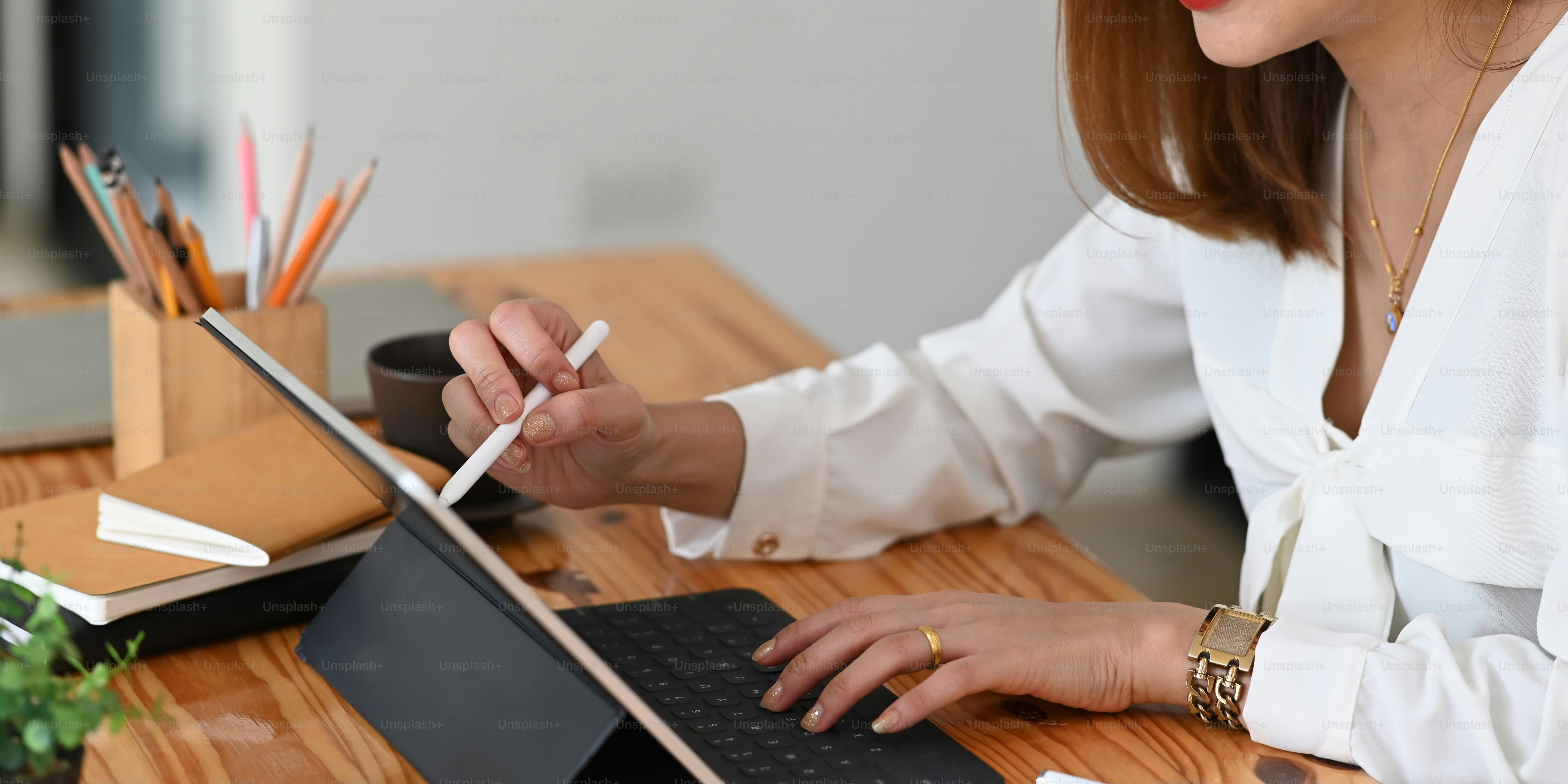 Photo of stylist woman designing a new project by using a stylus pen ...