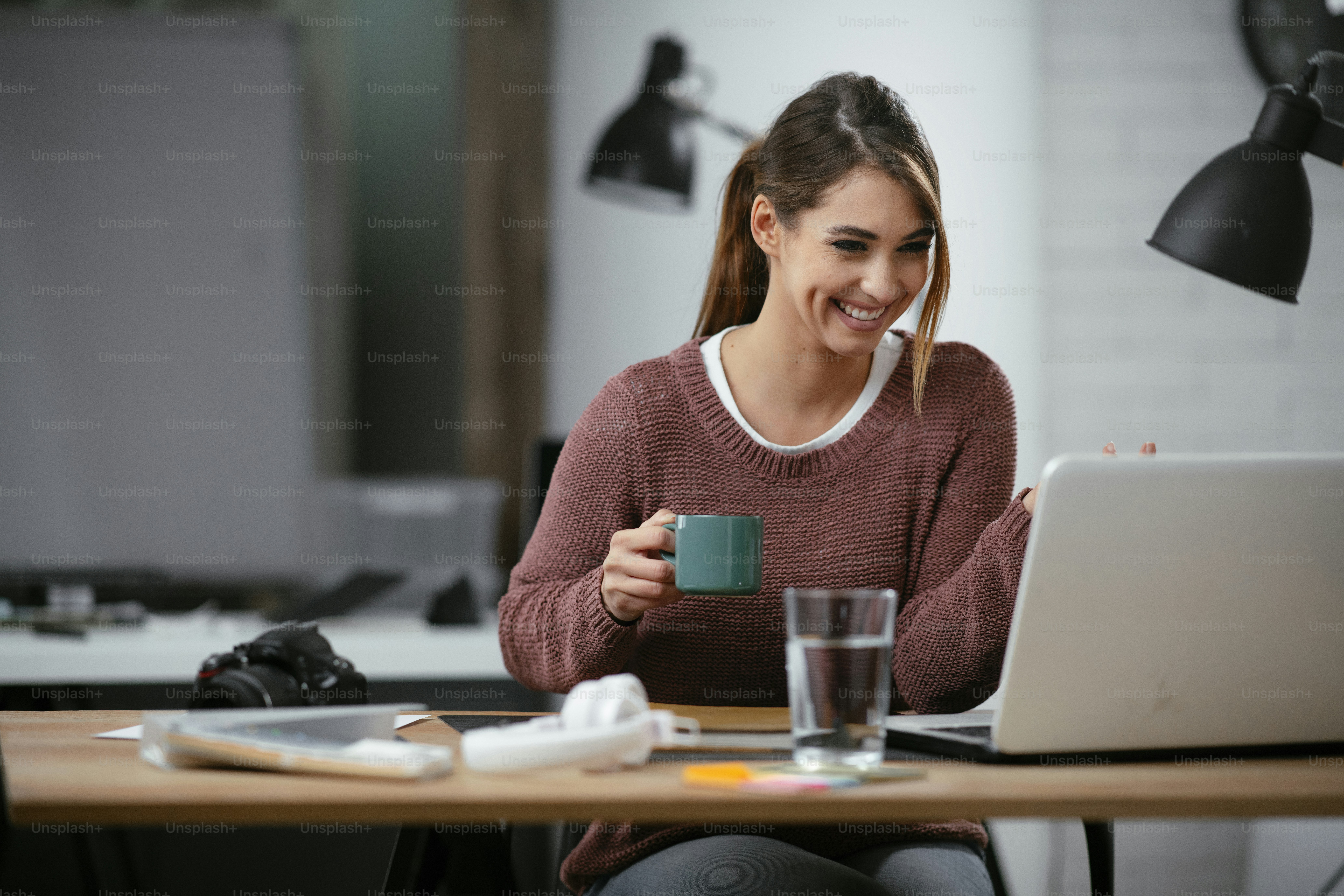 Beautiful businesswoman working in office. Young woman having fun at ...