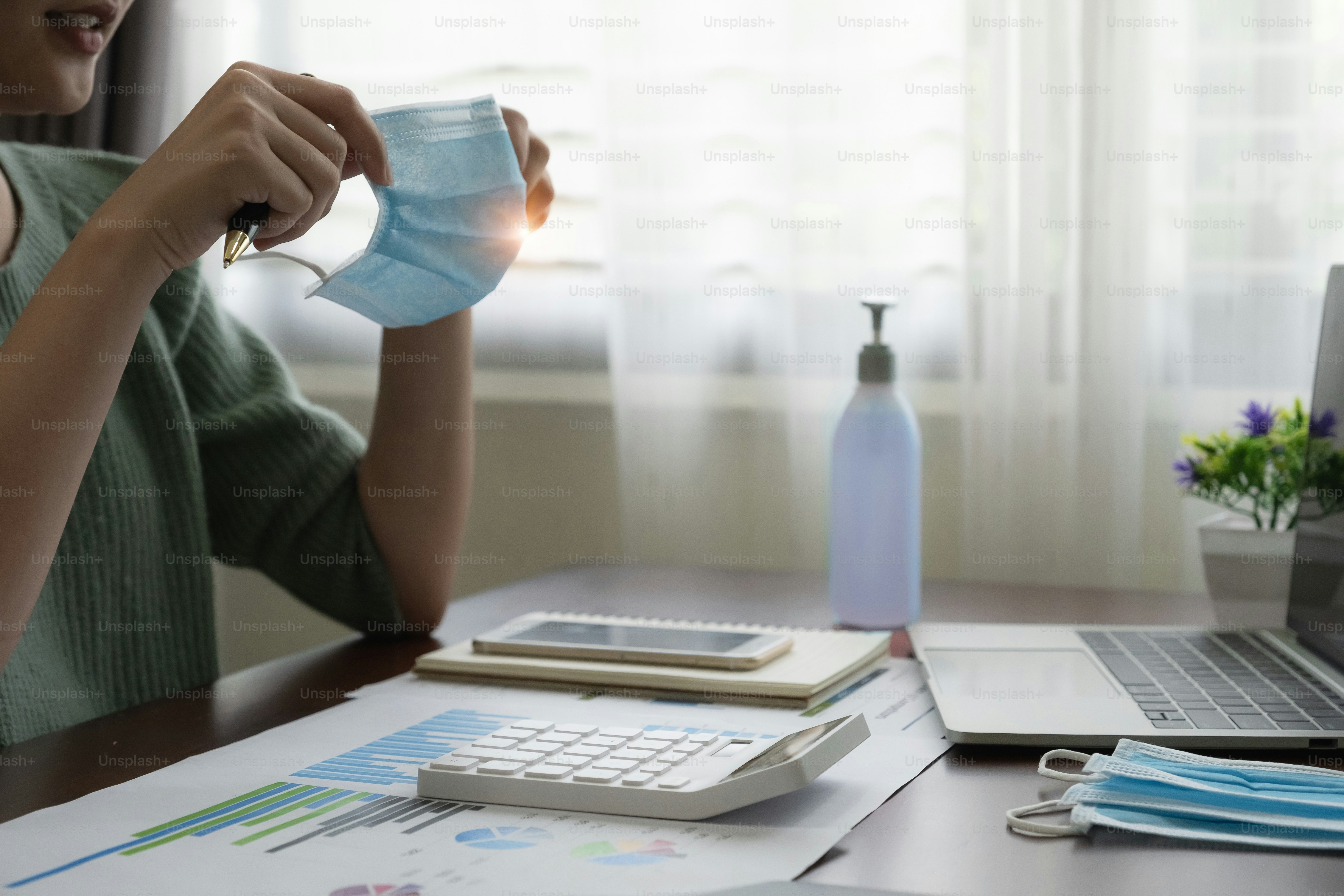 Businesswoman with mask to protect from corona virus or covid-19. work from home concept. photo ...