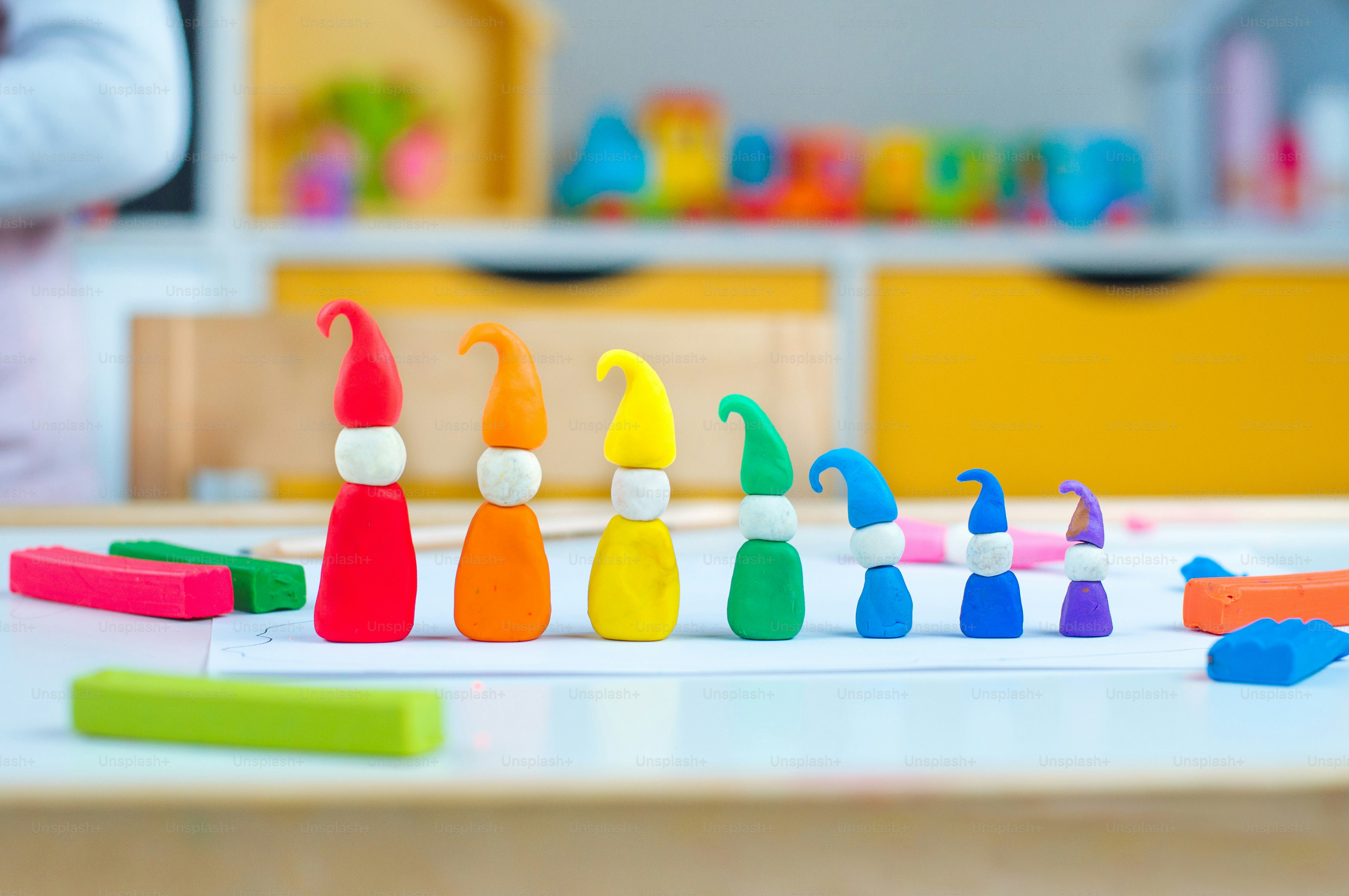Colorful gnomes from child's play clay on the table in the kids room ...