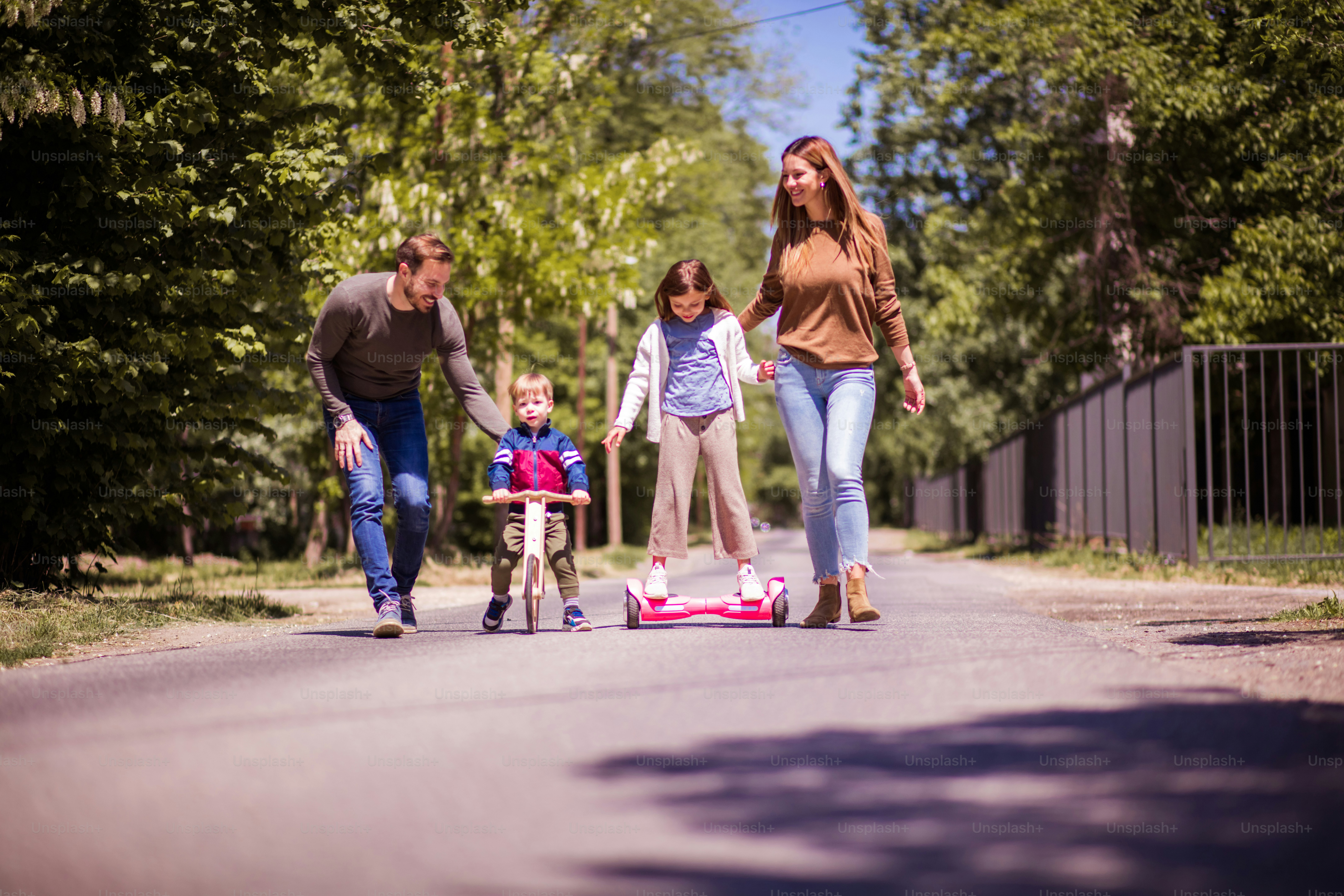 Time for a family adventure. Parents spending time with their children ...