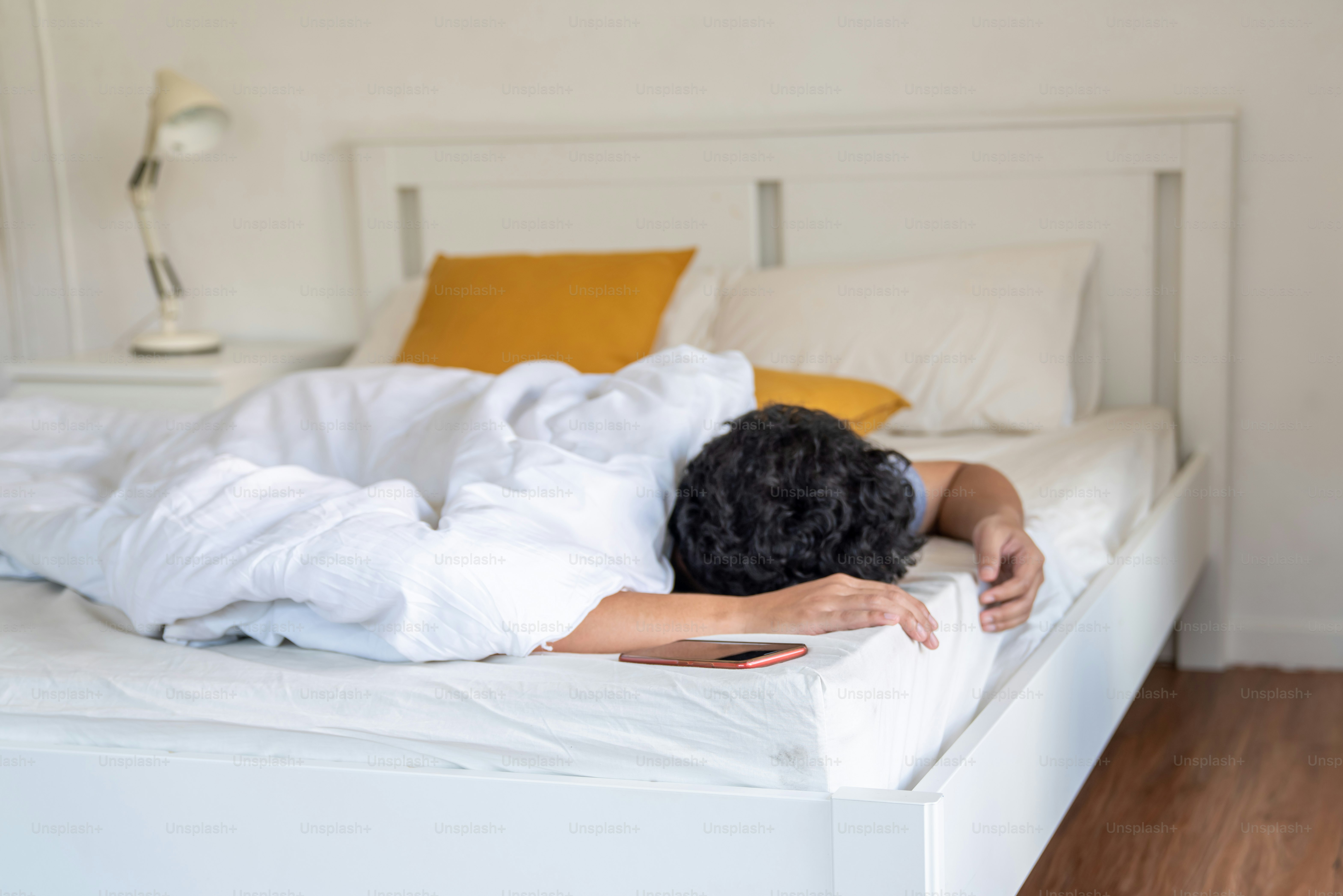 Asian man wake up late in the morning photo – Tired Image on Unsplash