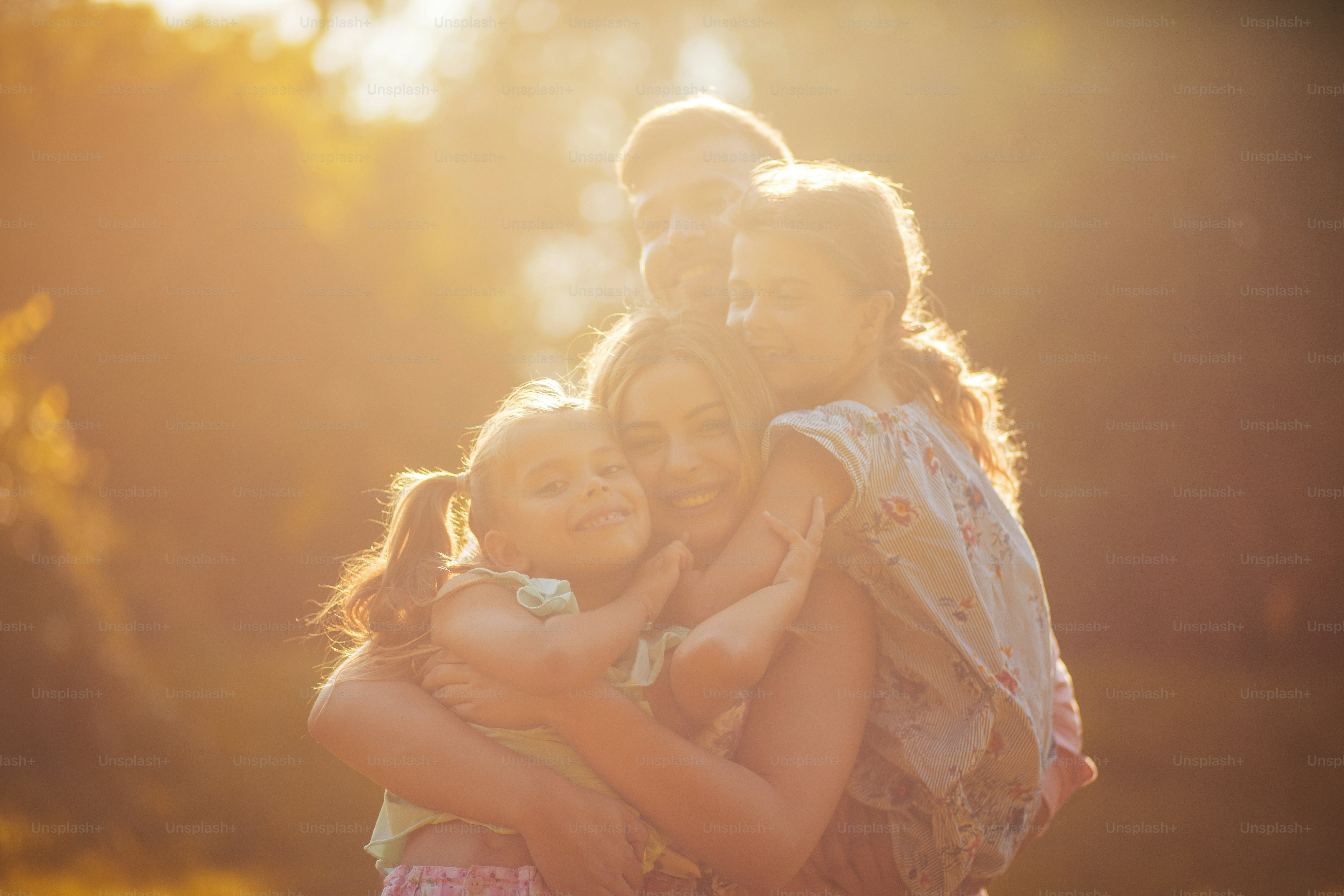 Family is bliss. Parents with daughters playing in nature. photo ...