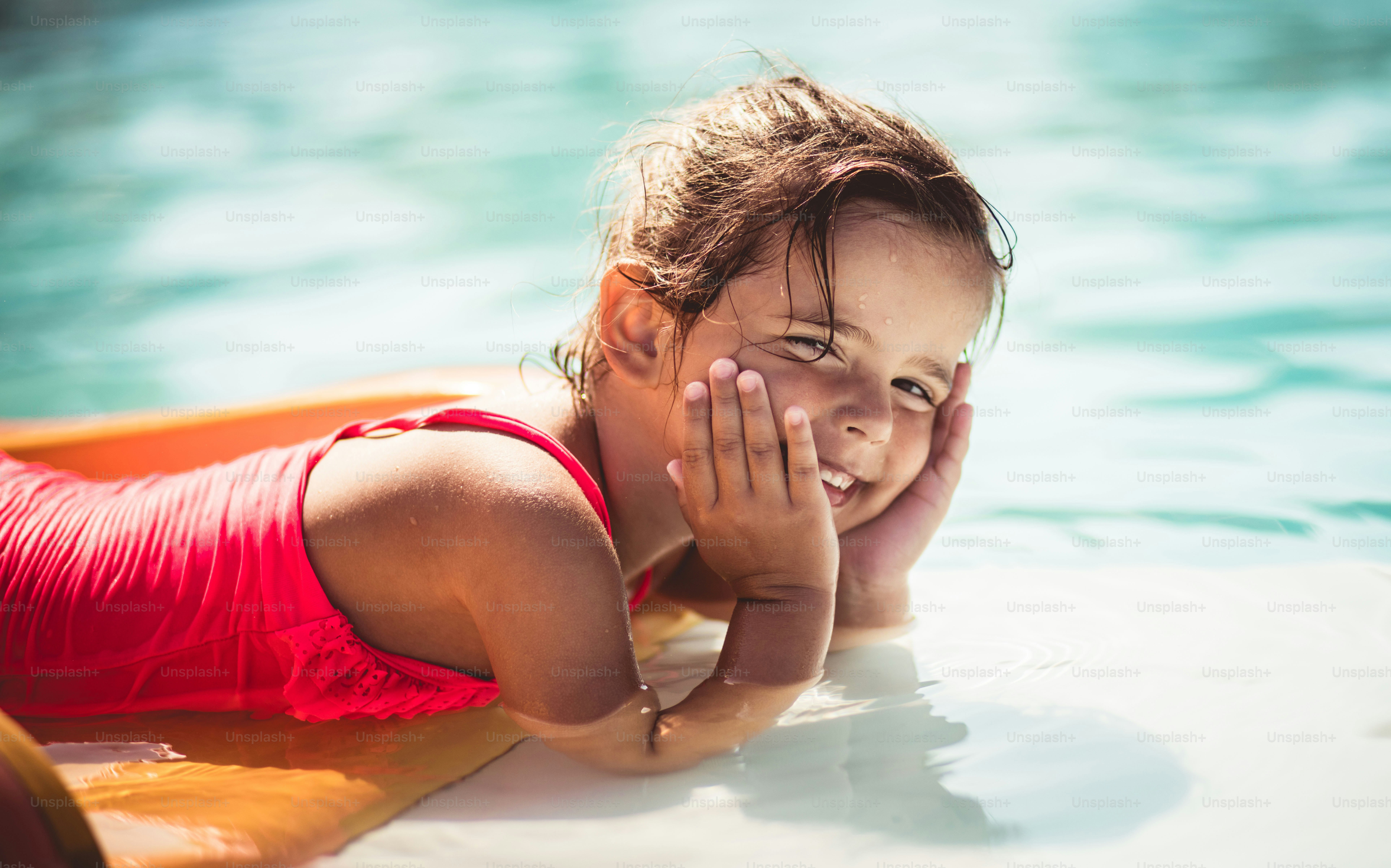Summer season. Children lying in pool. photo – Kids smiling Image on ...