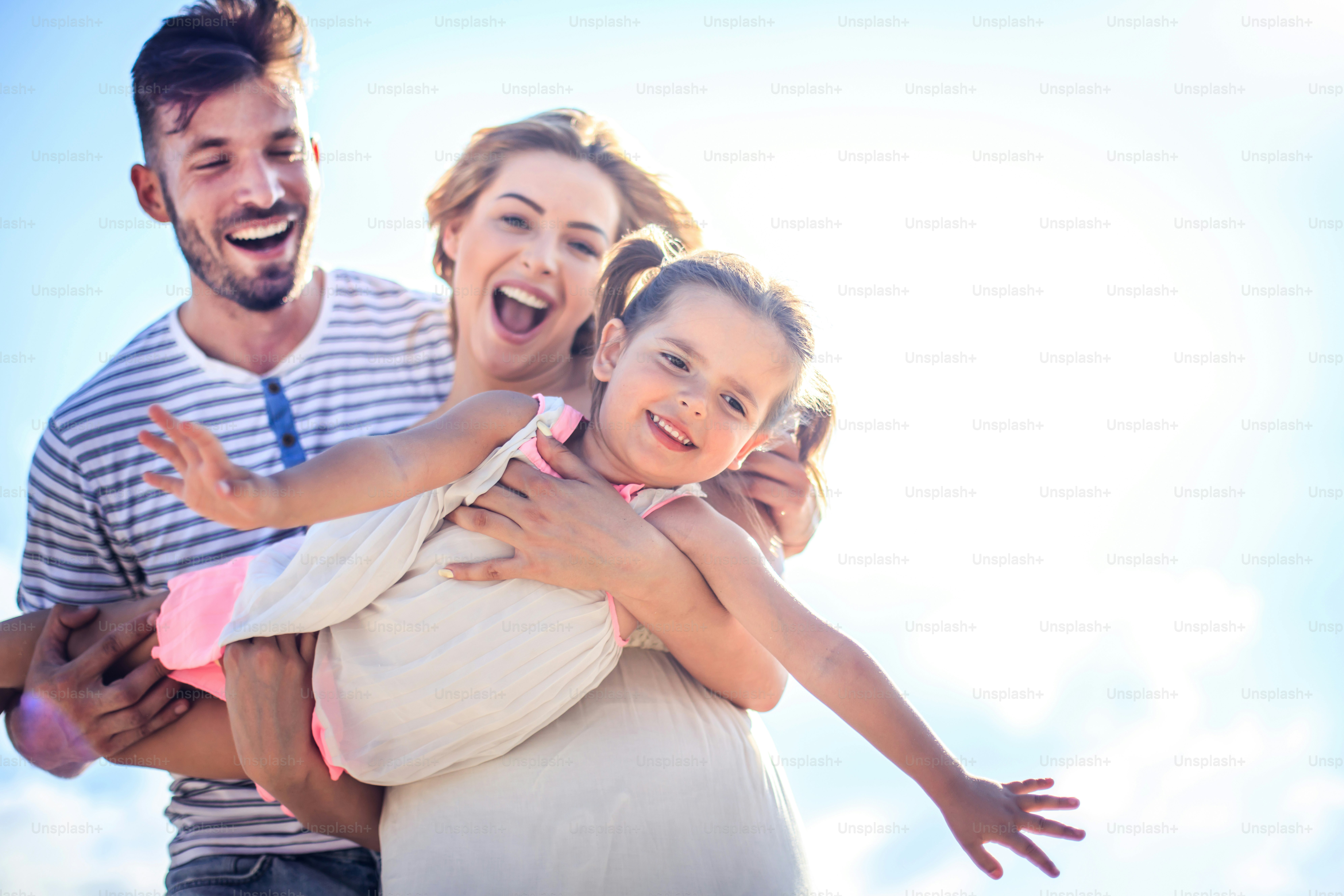 She is happy to have wonderful parents. Family outdoors. photo – People ...