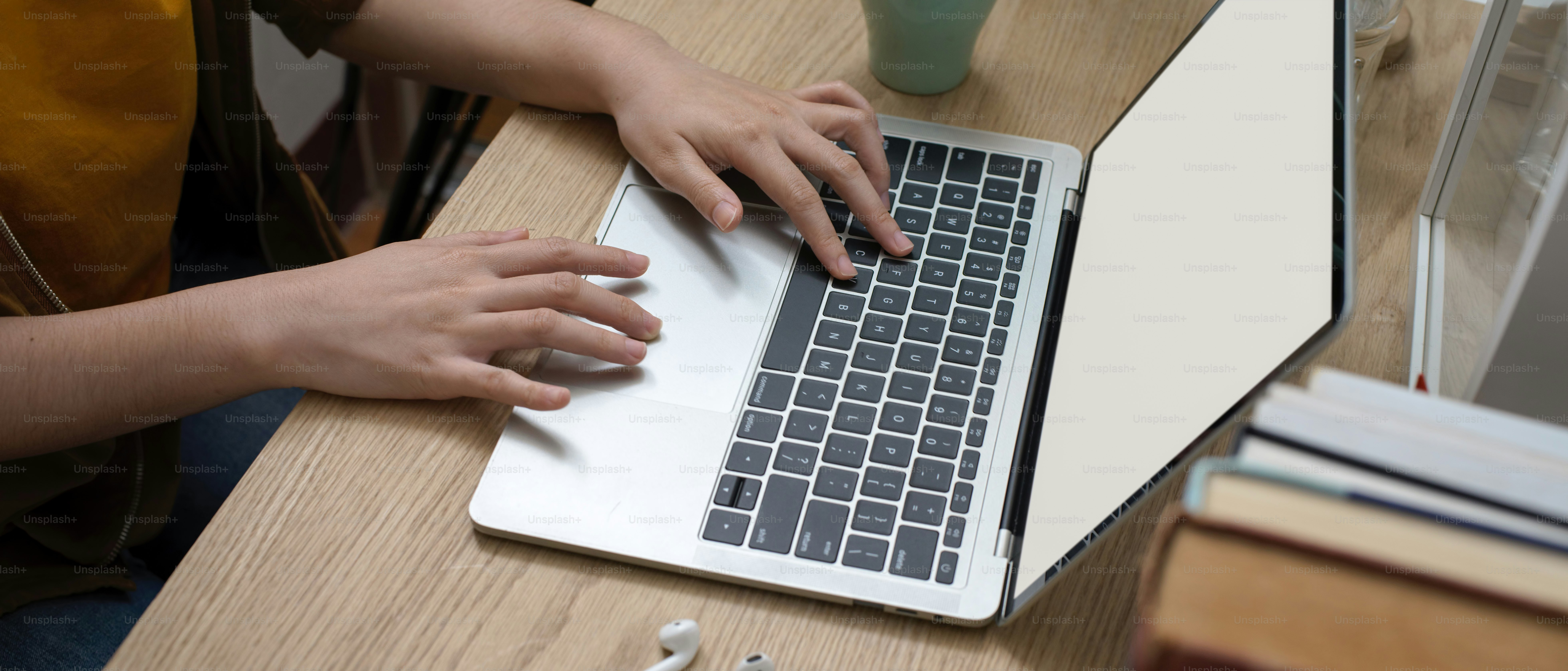 Side view of female college student working on her assignment with mock ...