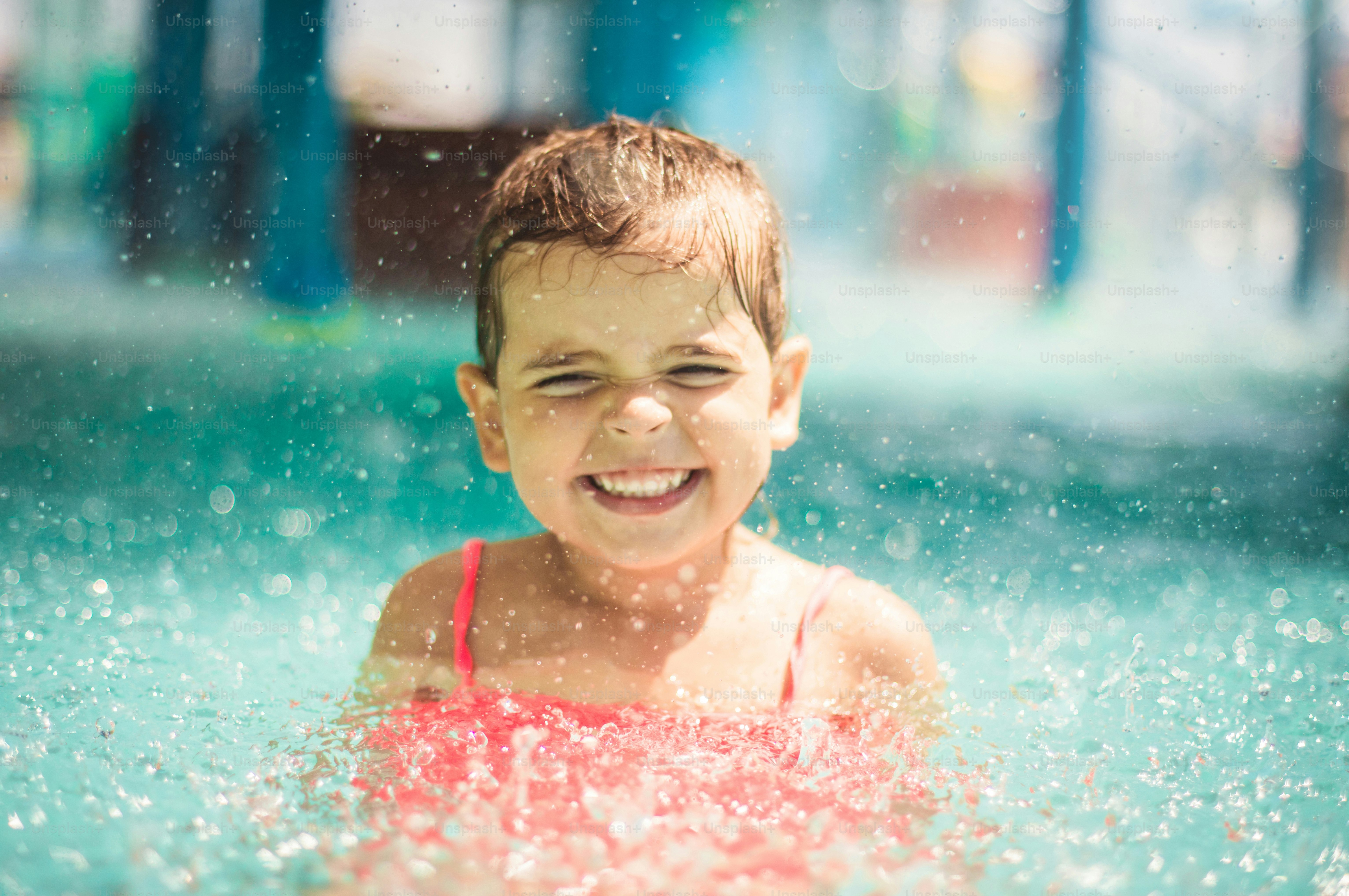 Splashing is so fun. Little girl in the pool. photo – Water Image on ...