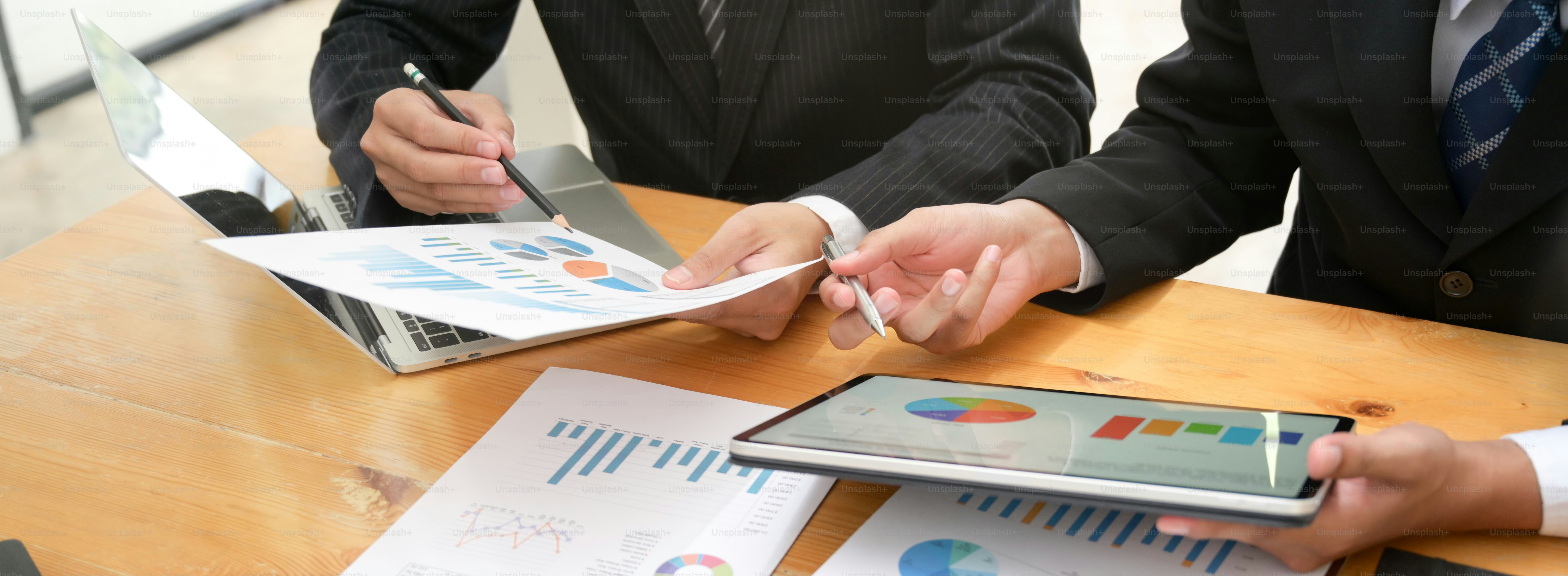 Close up view of business partner consulting on their collaboration ...