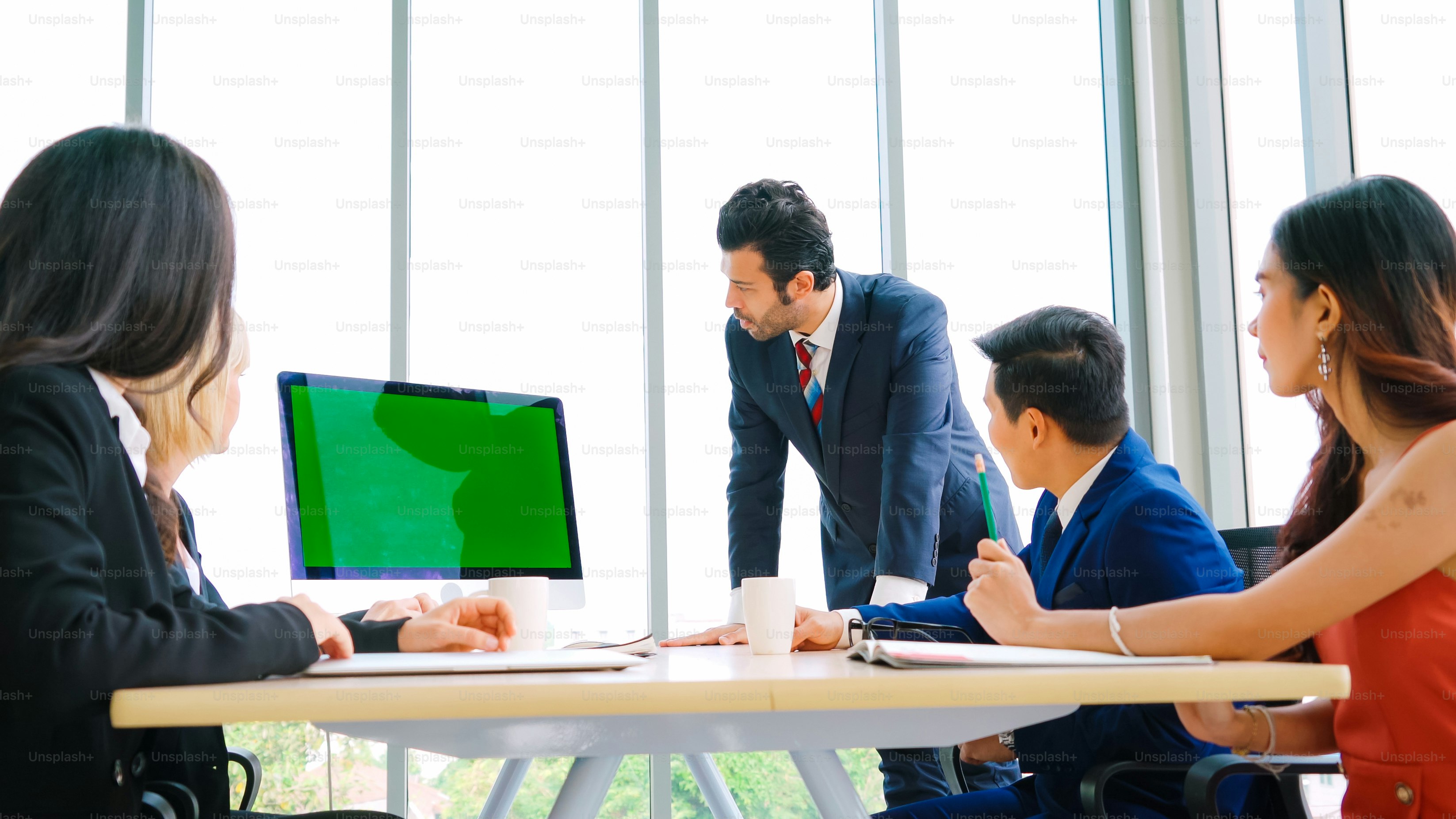 Business people in the conference room with green screen chroma key TV ...