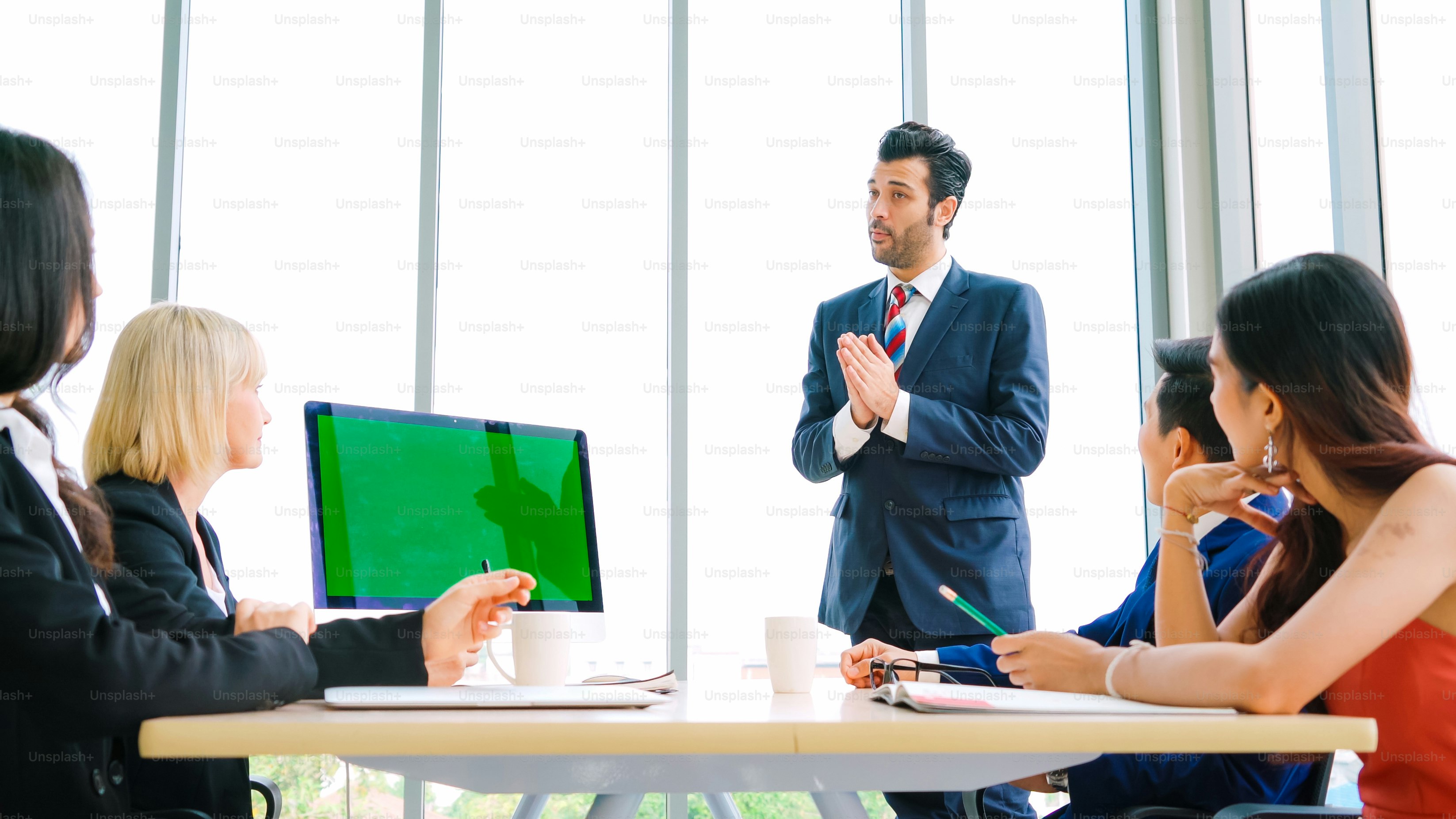 Business people in the conference room with green screen chroma key TV ...
