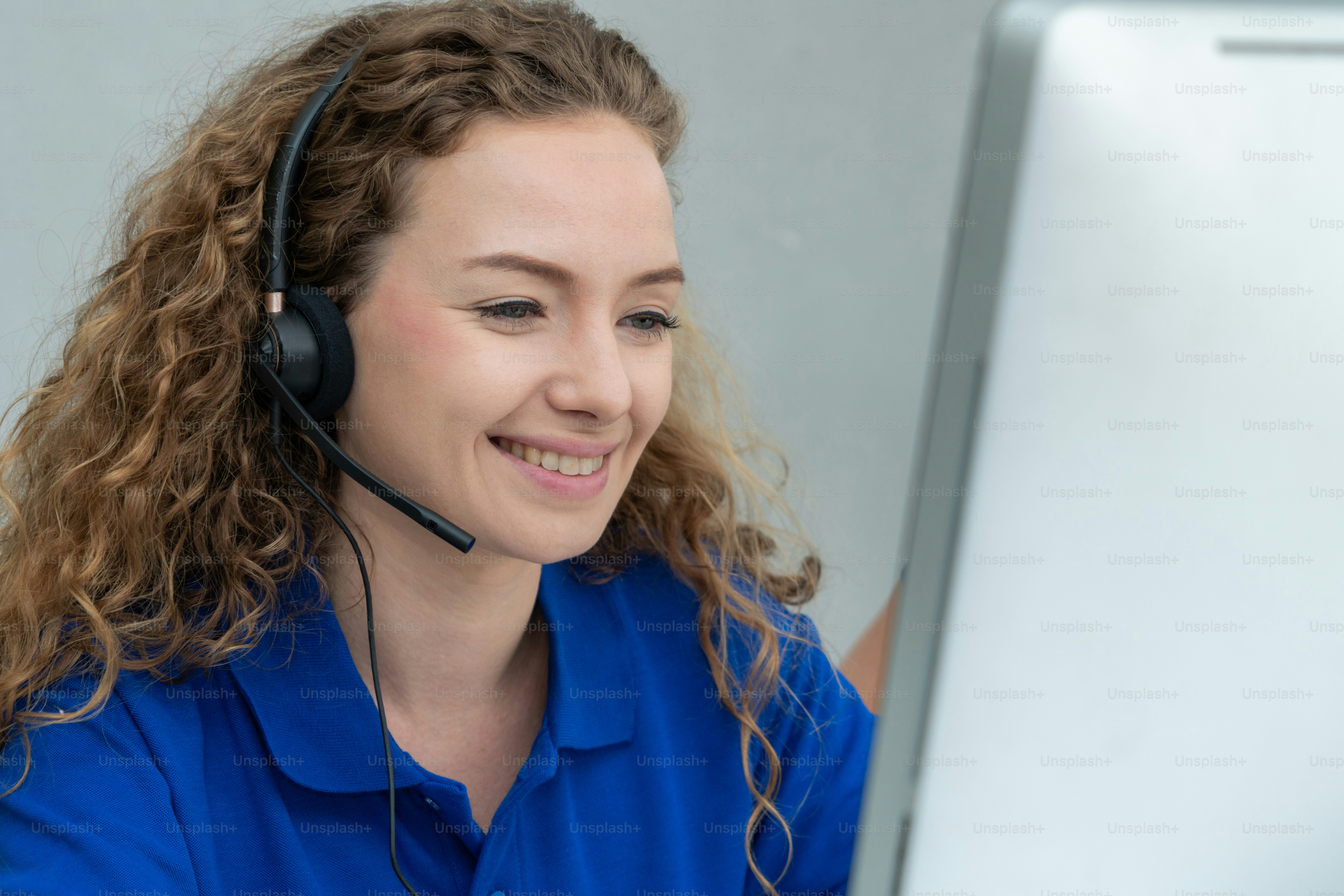 Business people wearing headset working in office to support remote ...