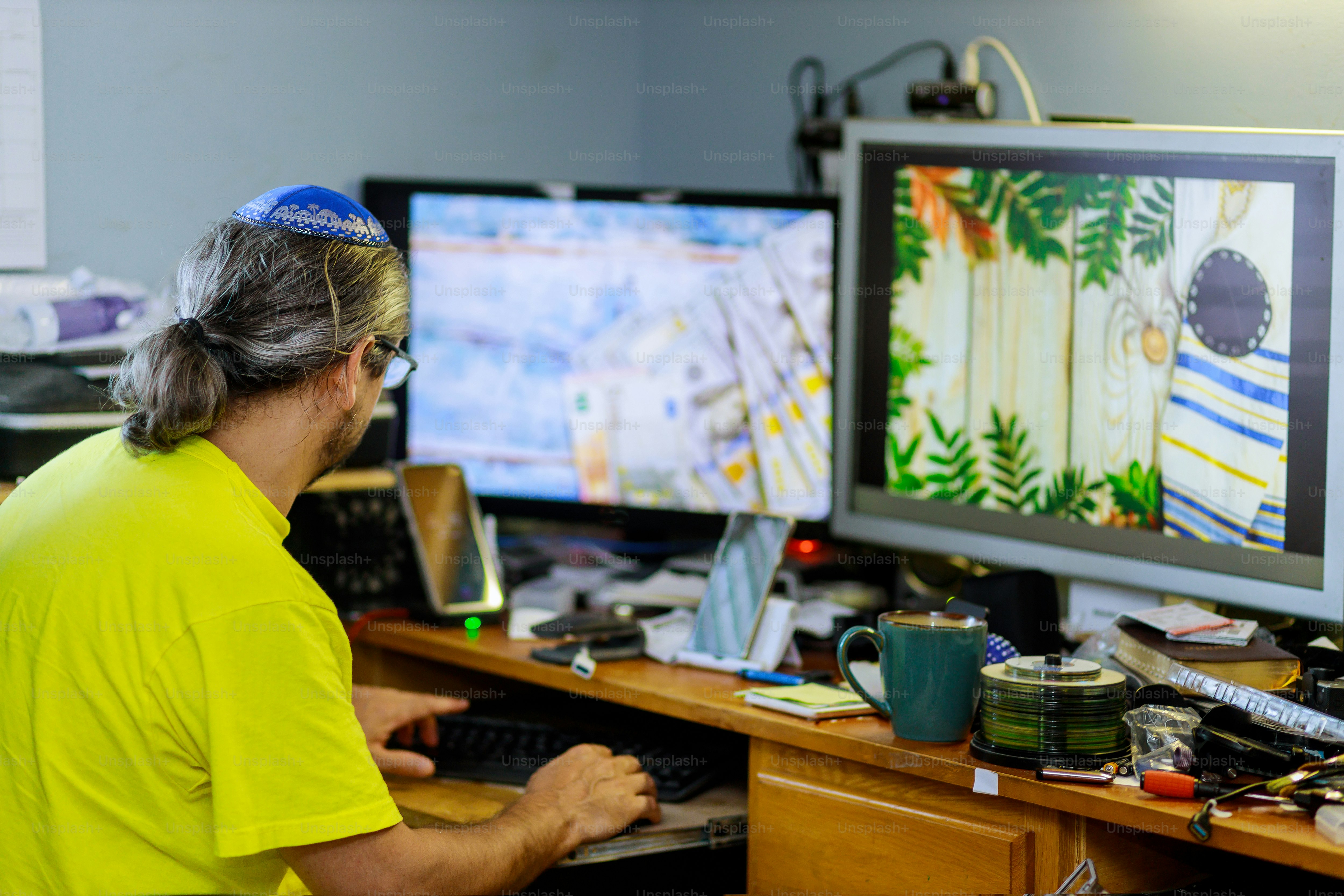 Jewish man designer working home on his typing texting on computer in a ...