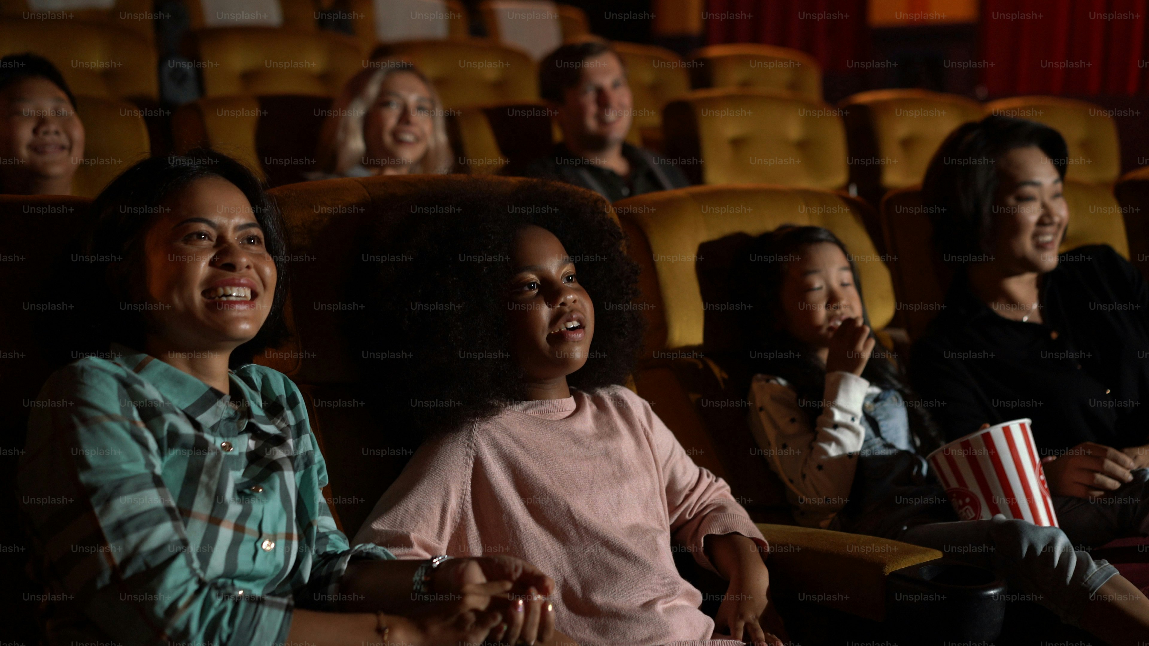 People audience watching movie in the movie theater cinema. Group ...