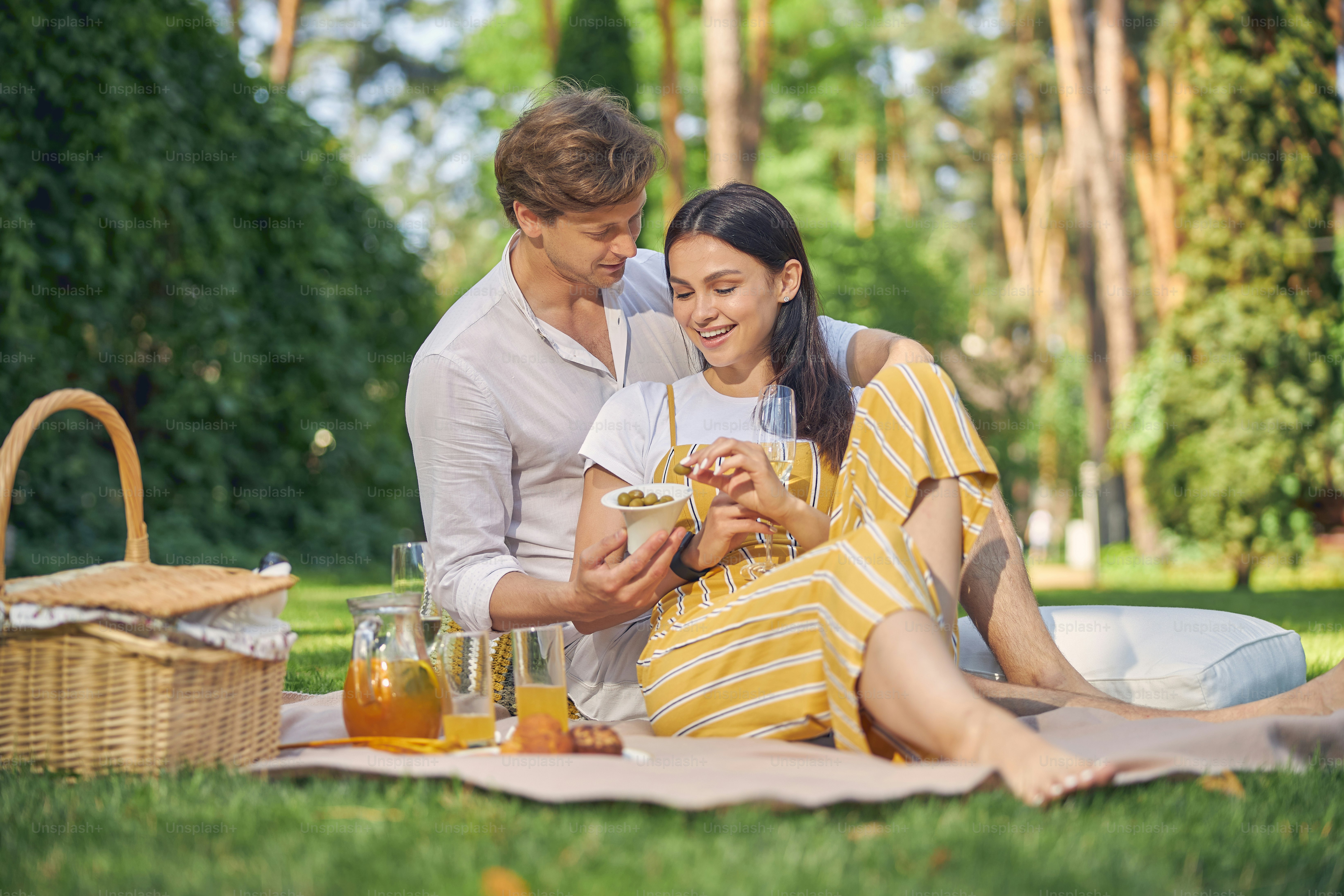 Portrait of good looking young people in white and yellow clothing ...