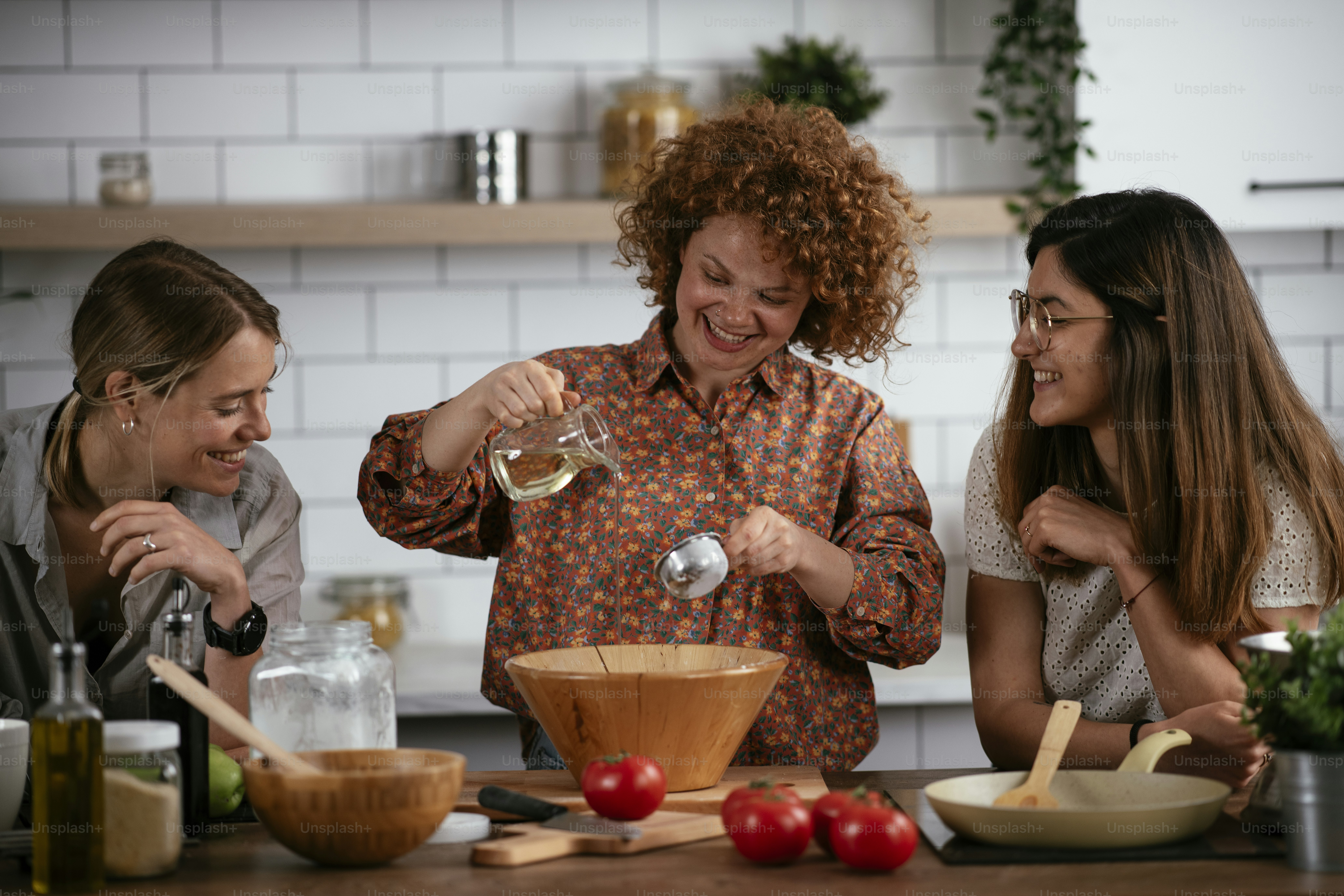 Girlfriends having fun in the kitchen. Sisters cooking together. photo ...
