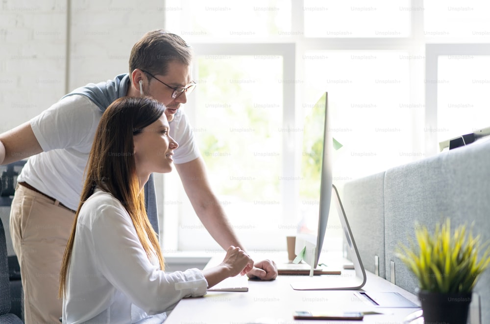 Coworkers team in modern office. Project managers work new idea. Young ... Coworkers team in modern office. Project managers work new idea. Young ...
