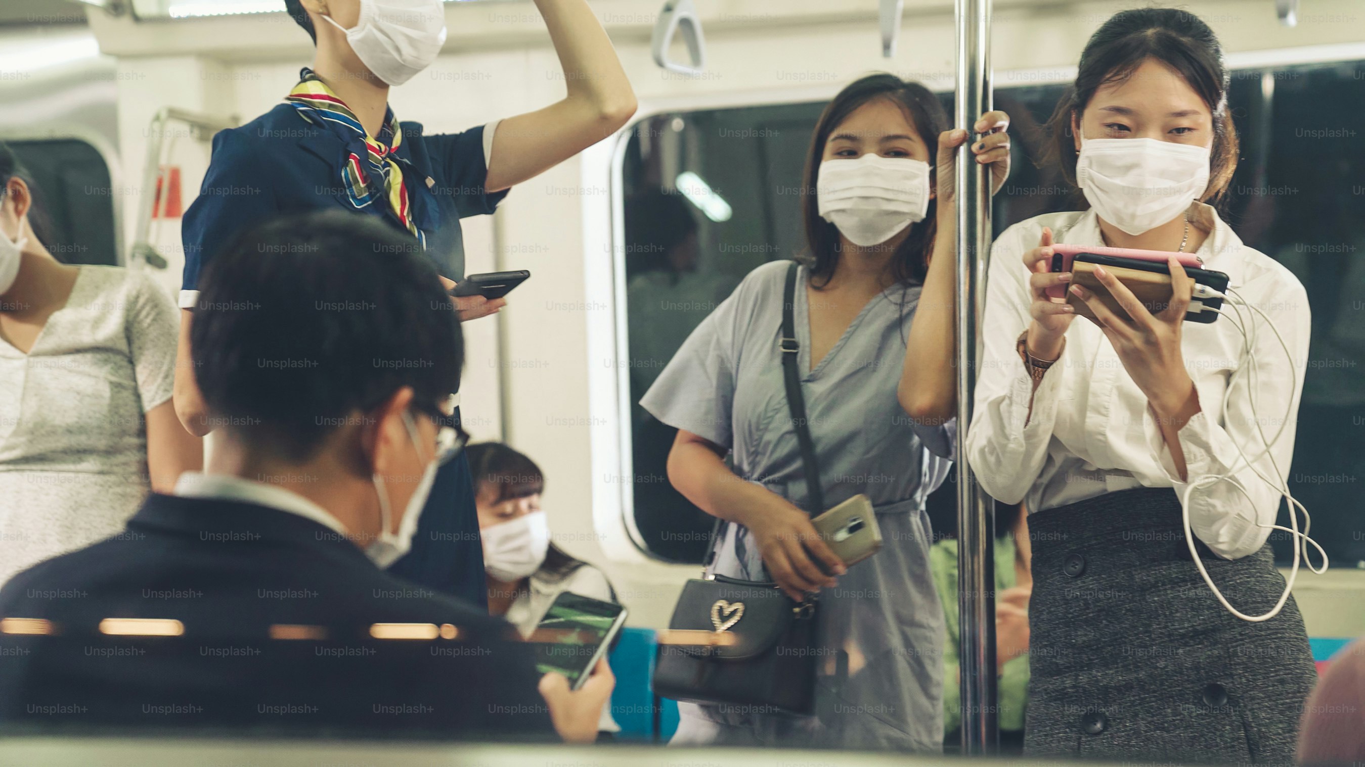 Crowd of people wearing face mask on a crowded public subway train ...