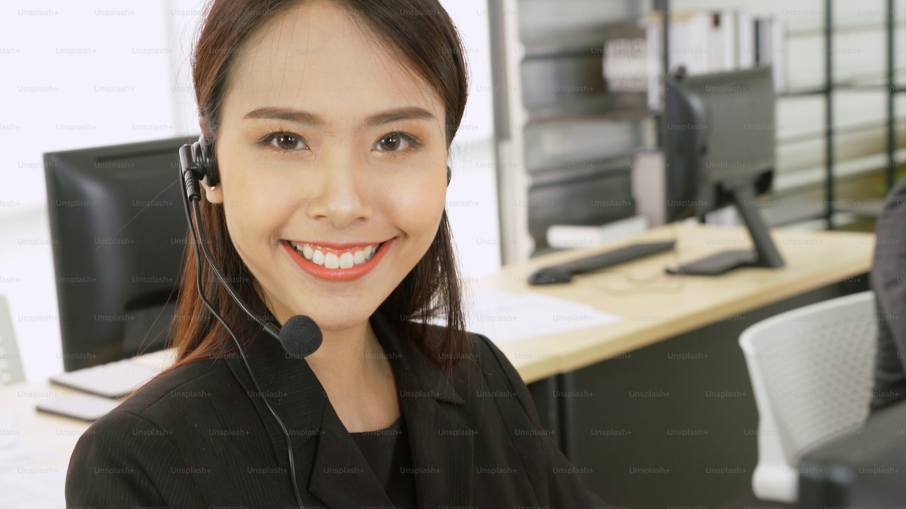 Business people wearing headset working in office to support remote ...
