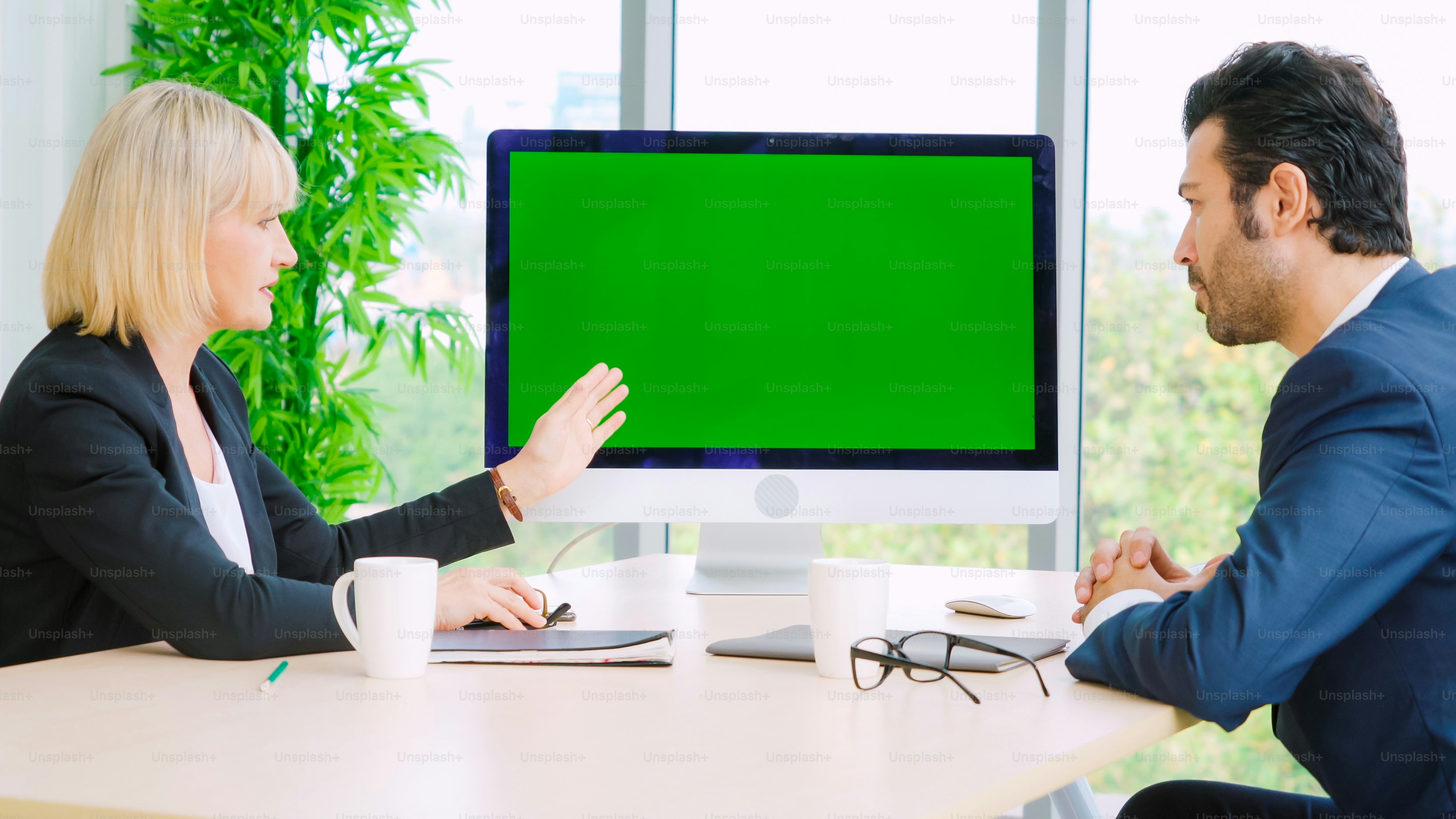 Business people in the conference room with green screen chroma key TV ...
