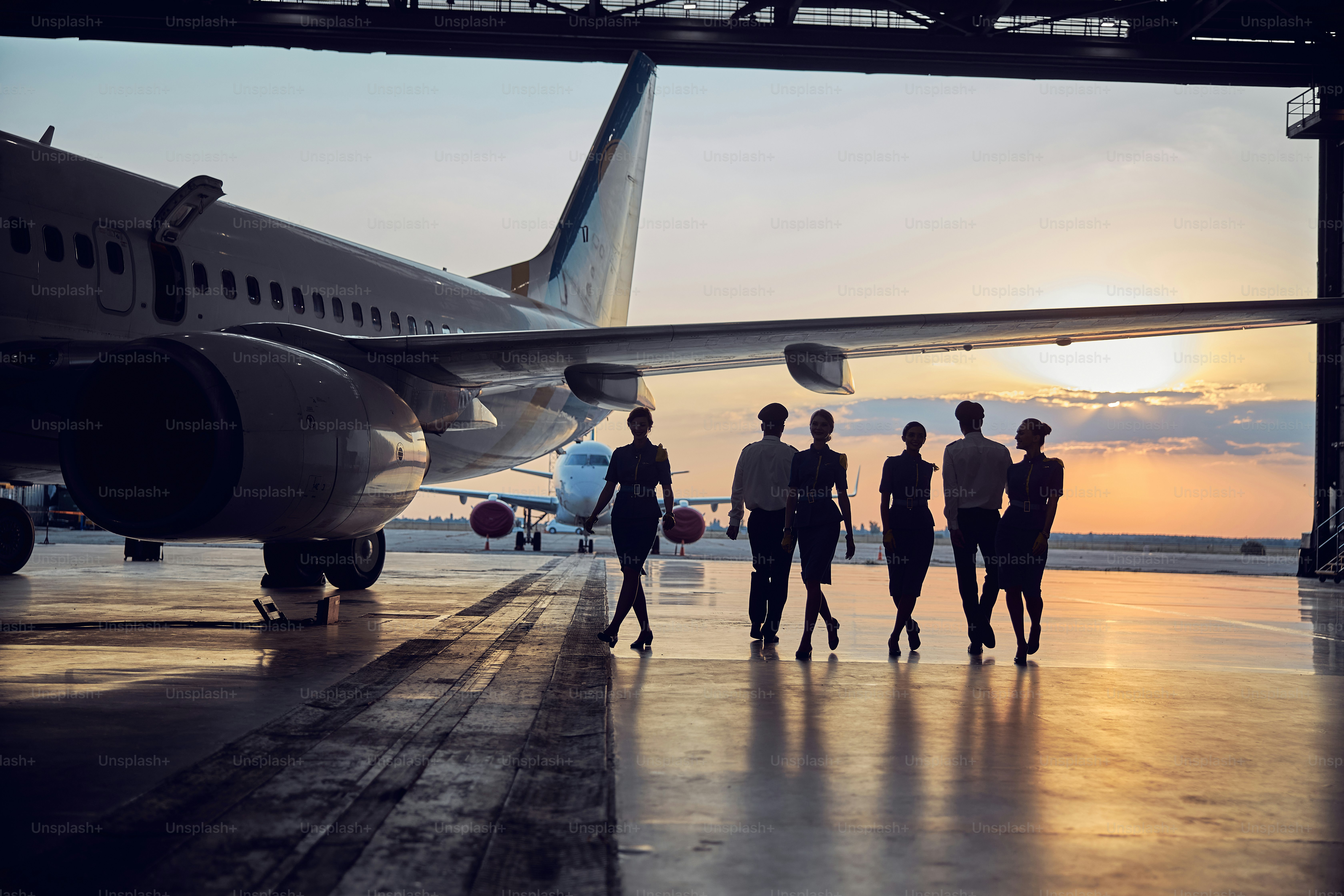 Image of big passenger airplane standing at the airport hangar while ...