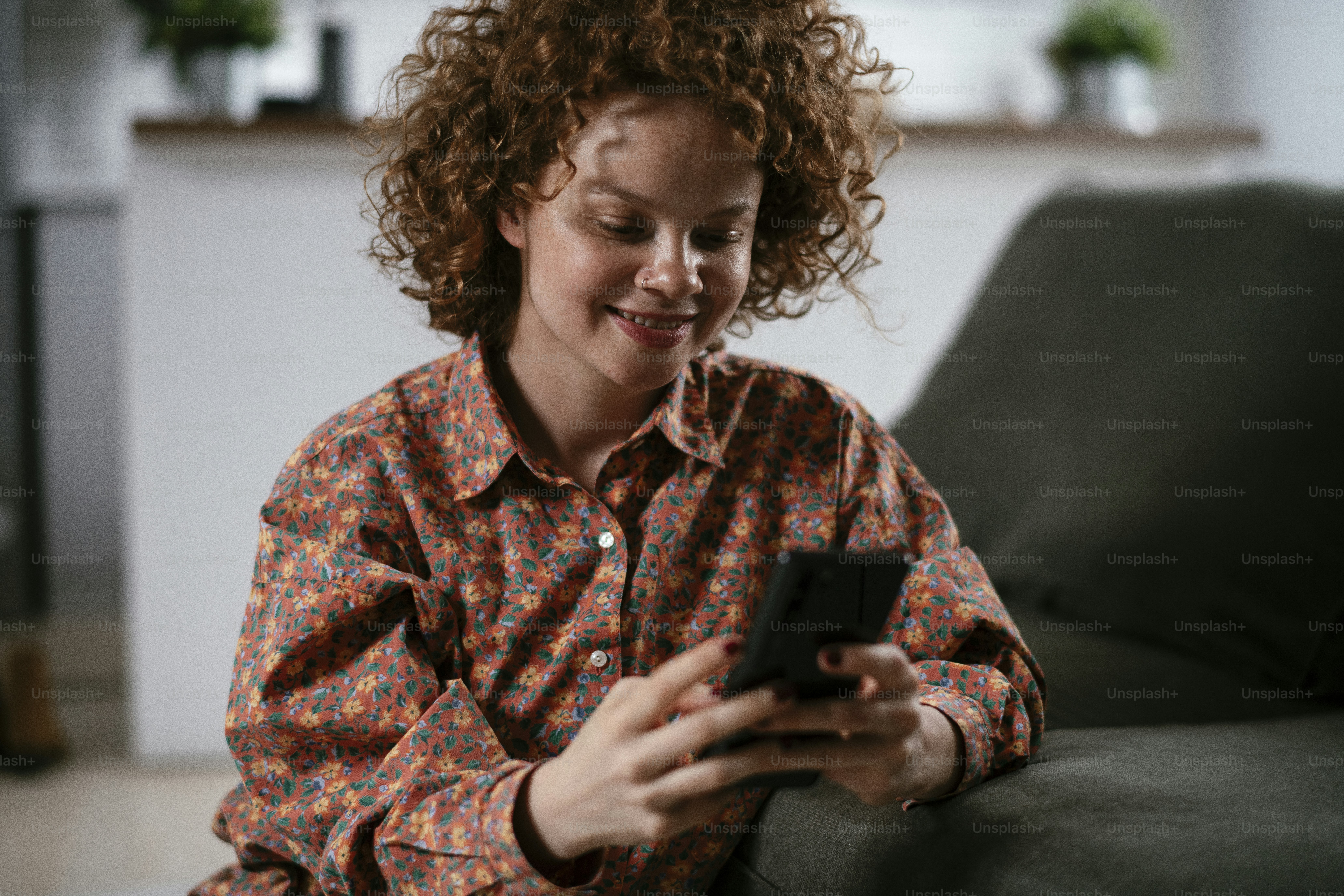 Young woman using the phone. Beautiful woman enjoying at home. photo ...