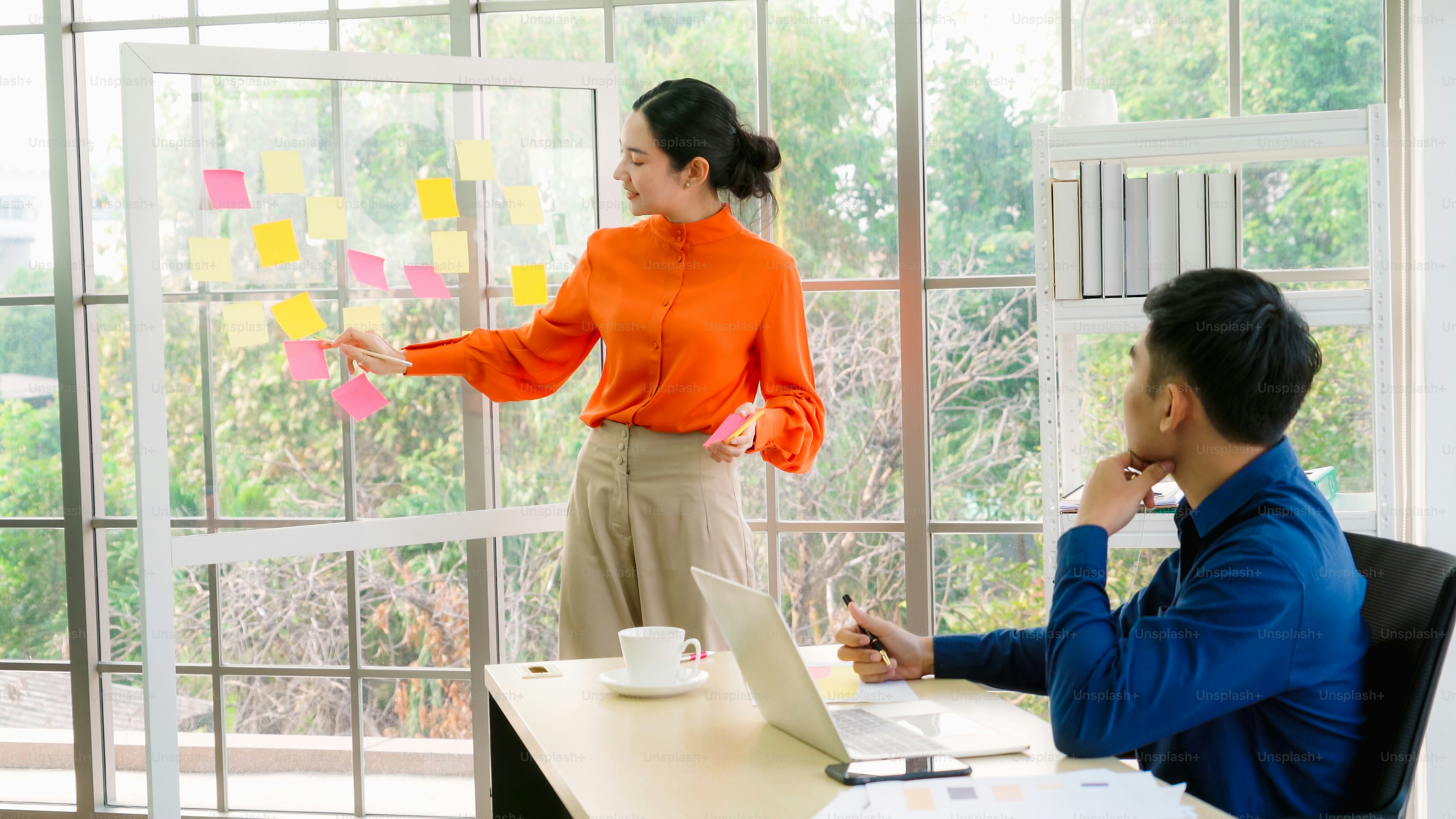 Business people work on project planning board in office and having ...