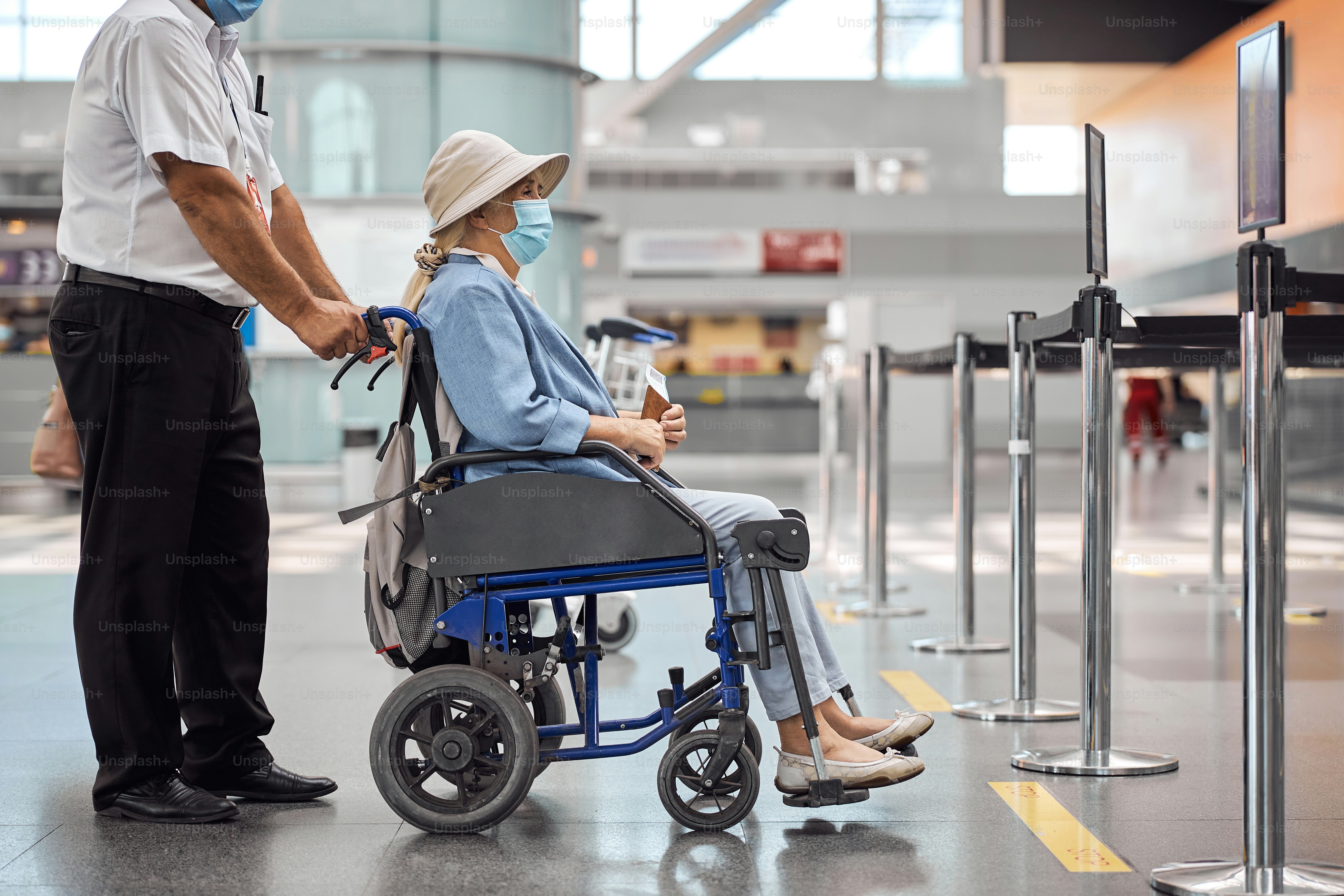 Side view of a disabled airline passenger being transported to an ...