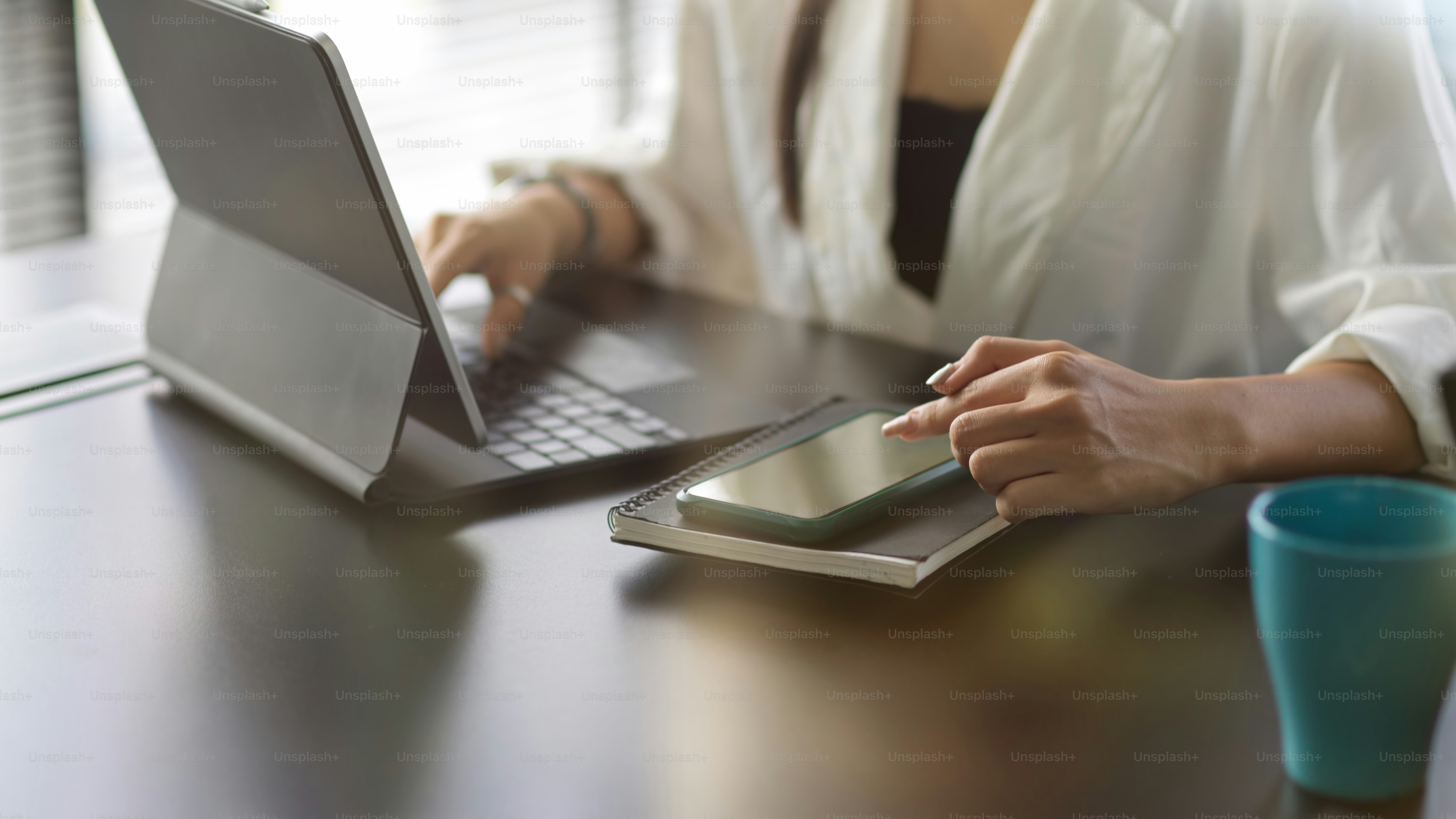 Cropped shot of young businesswoman working on her project with tablet ...