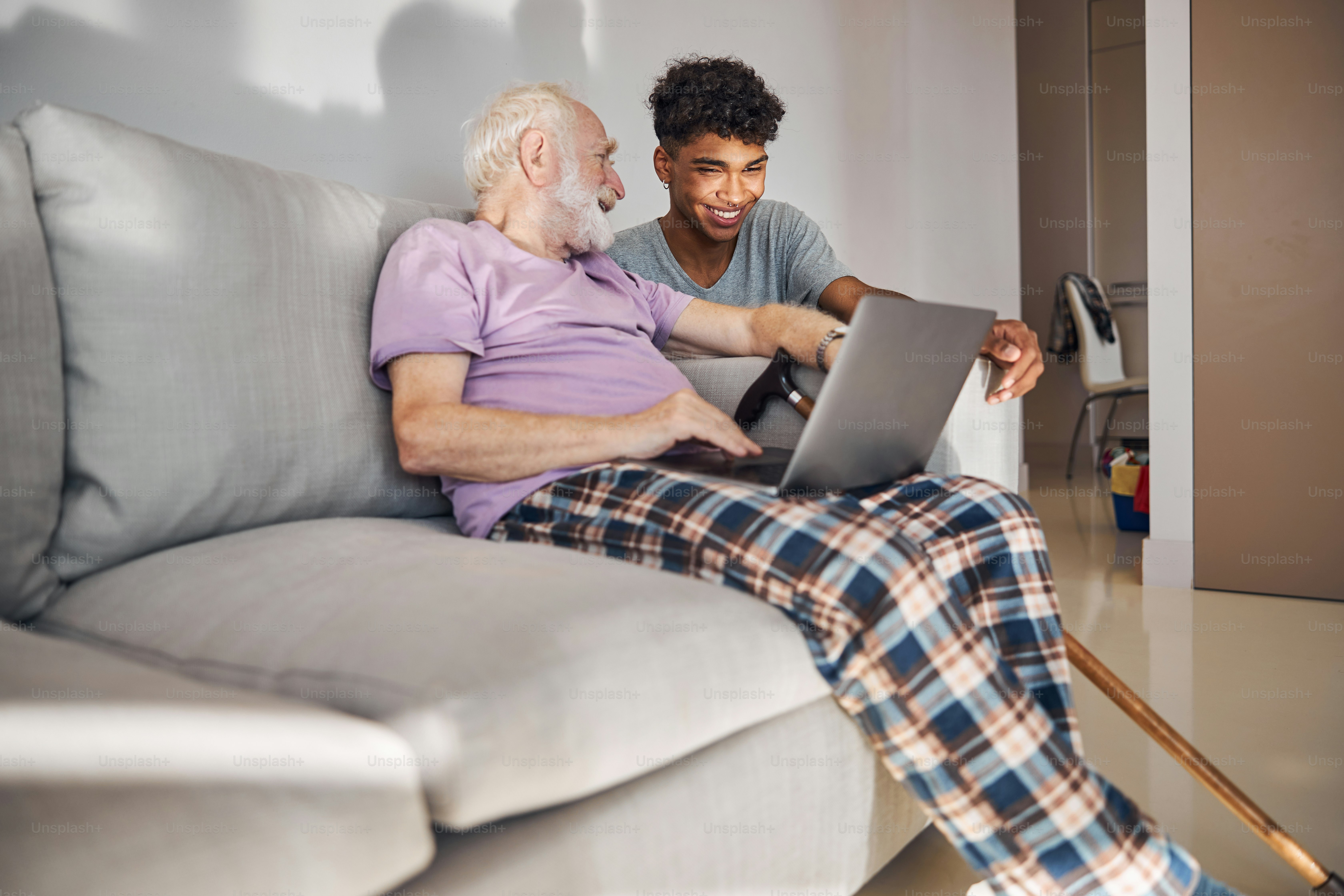 African American male volunteer spending his spare time with a resident ...