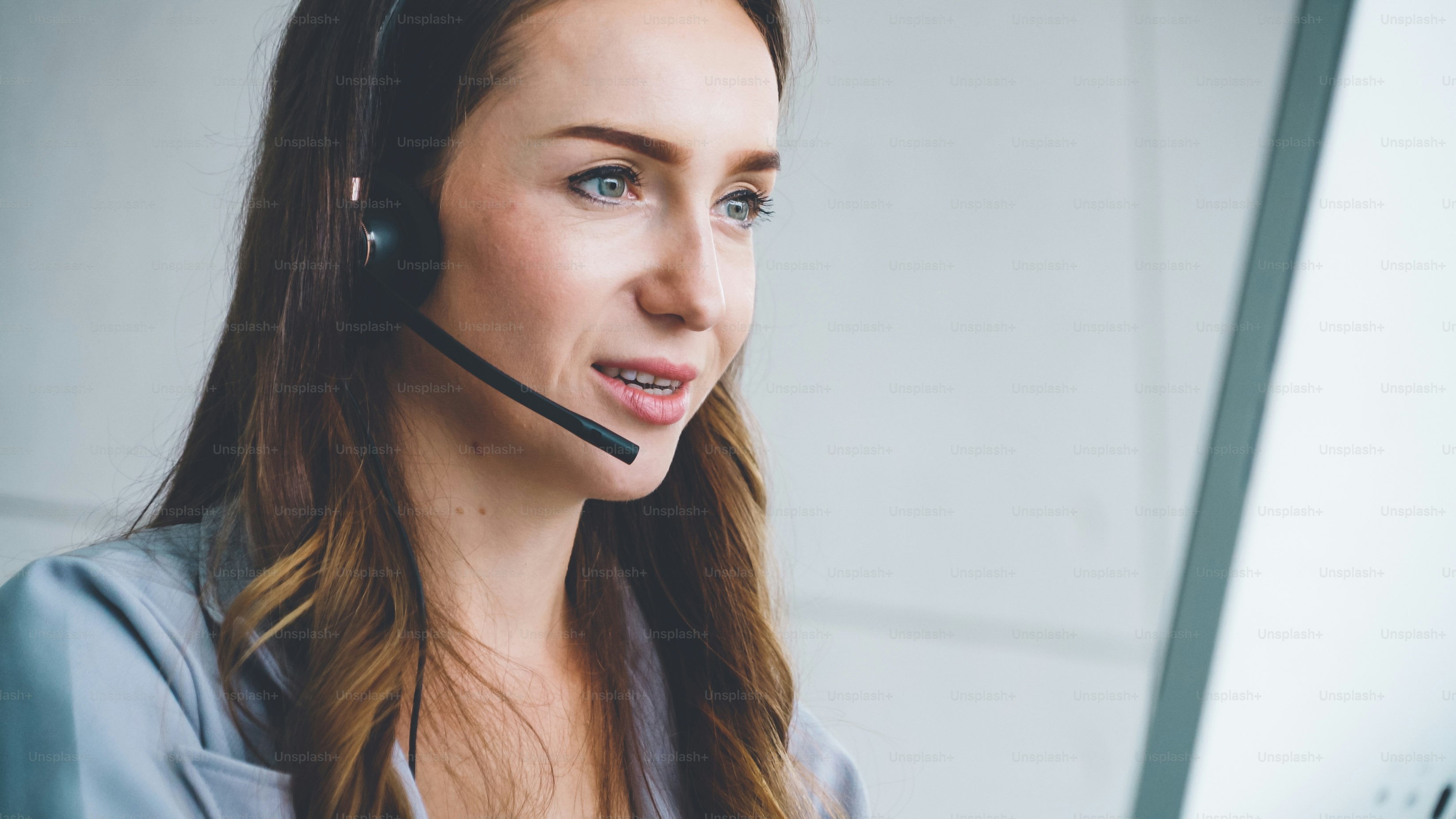 Business people wearing headset working in office to support remote ...