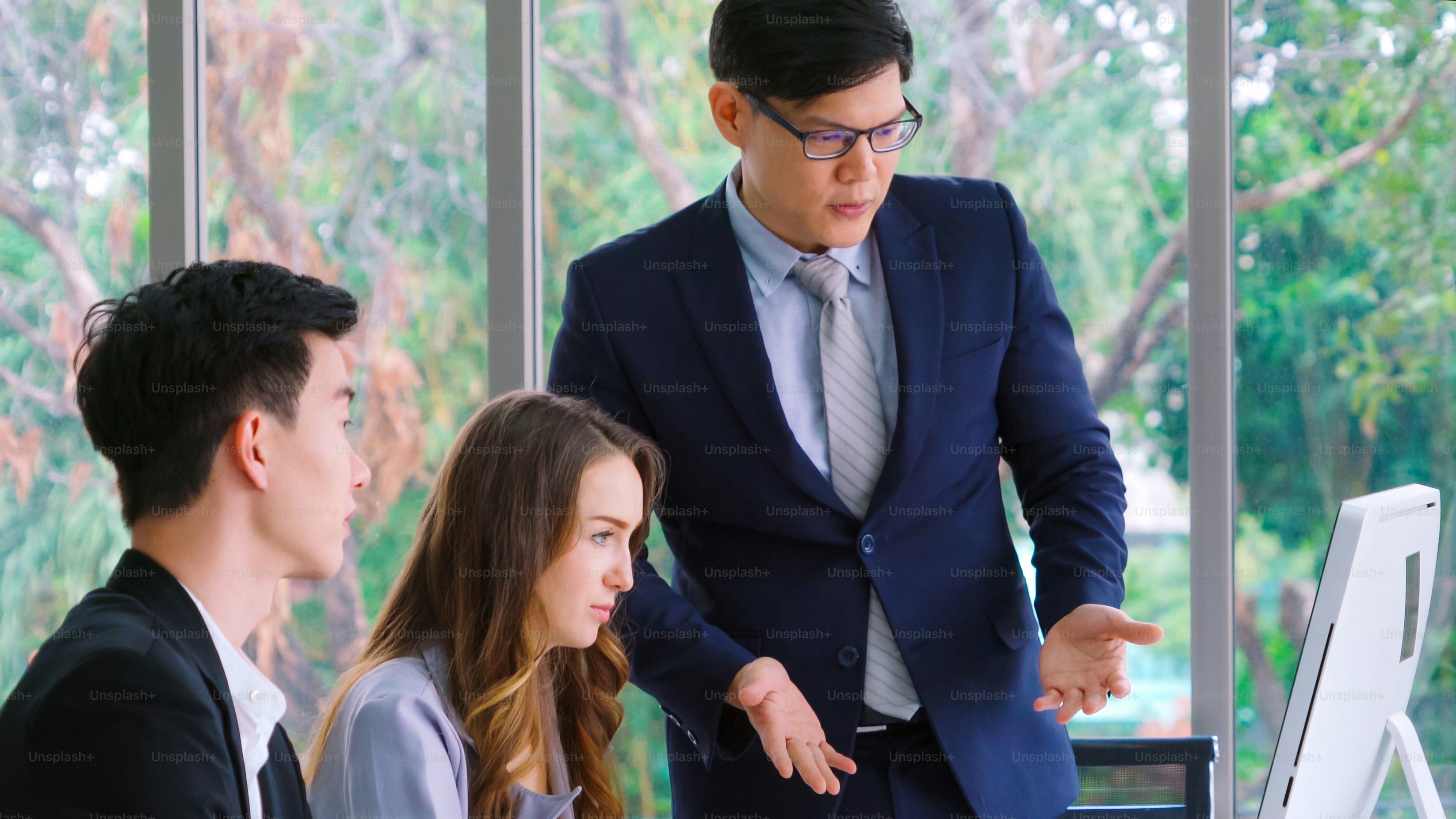 Smart businessman and businesswoman talking discussion in group meeting ...