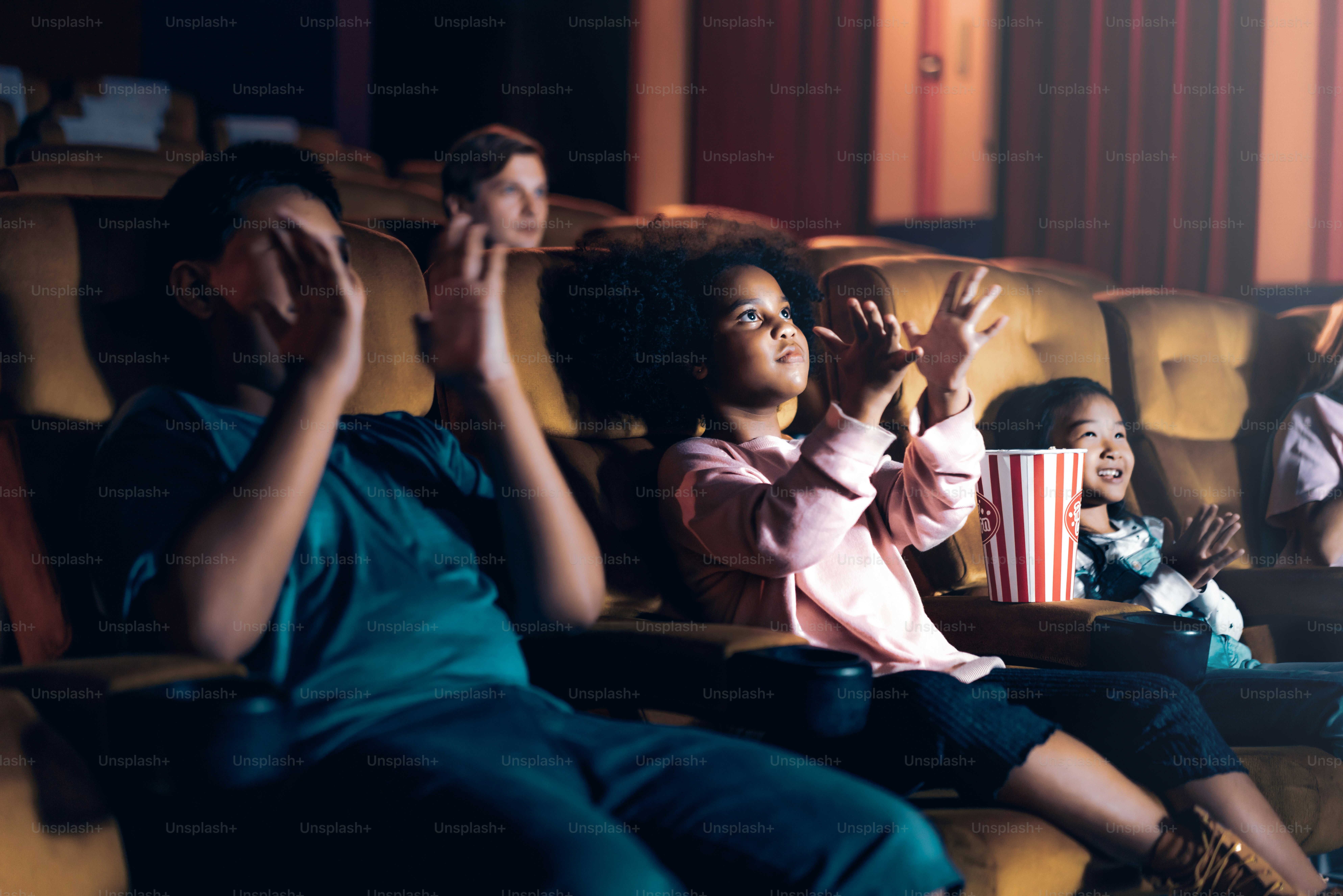 People audience watching movie in the movie theater cinema. Group ...