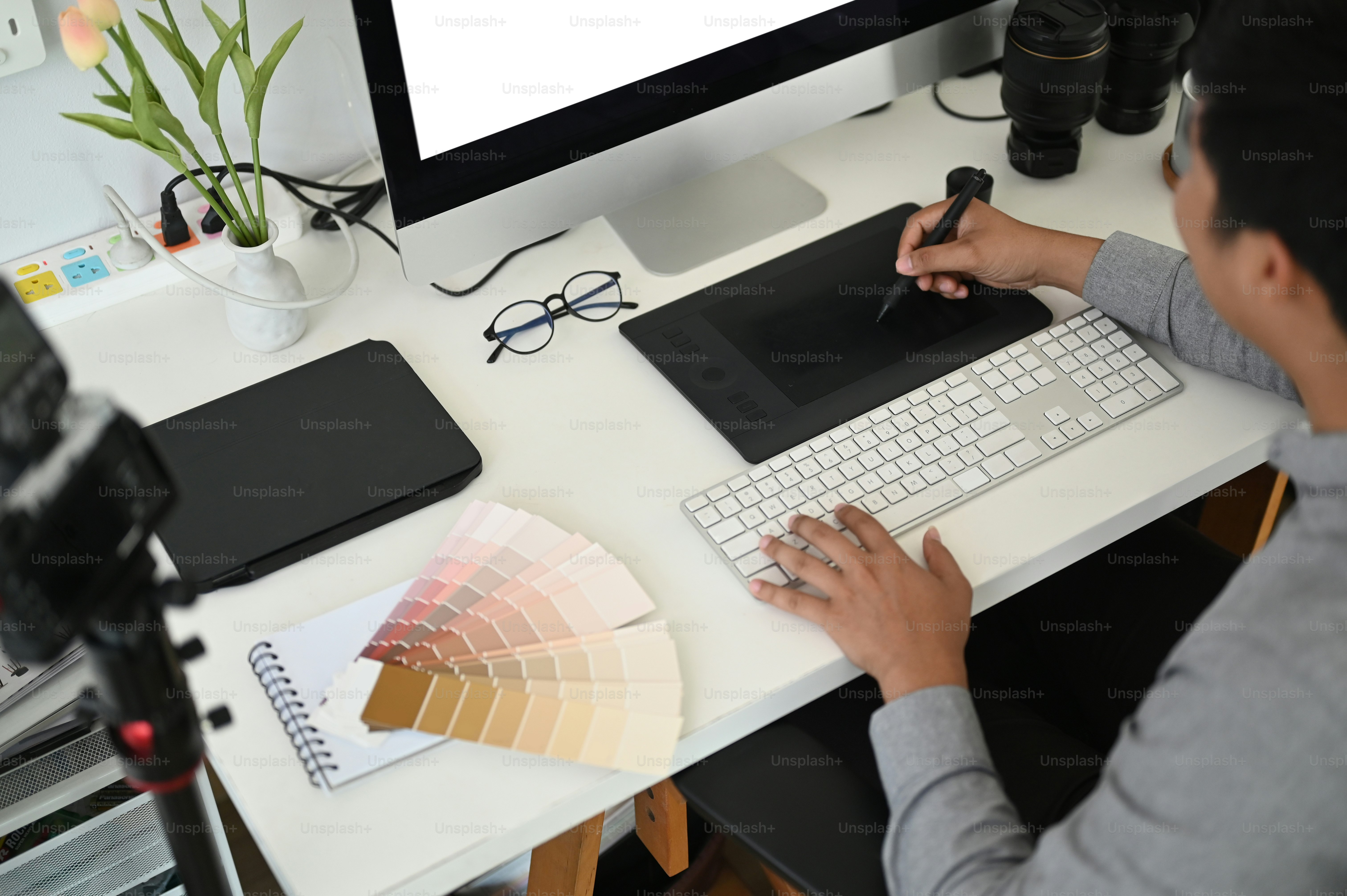 Cropped shot of a male graphic designer working with interactive pen ...