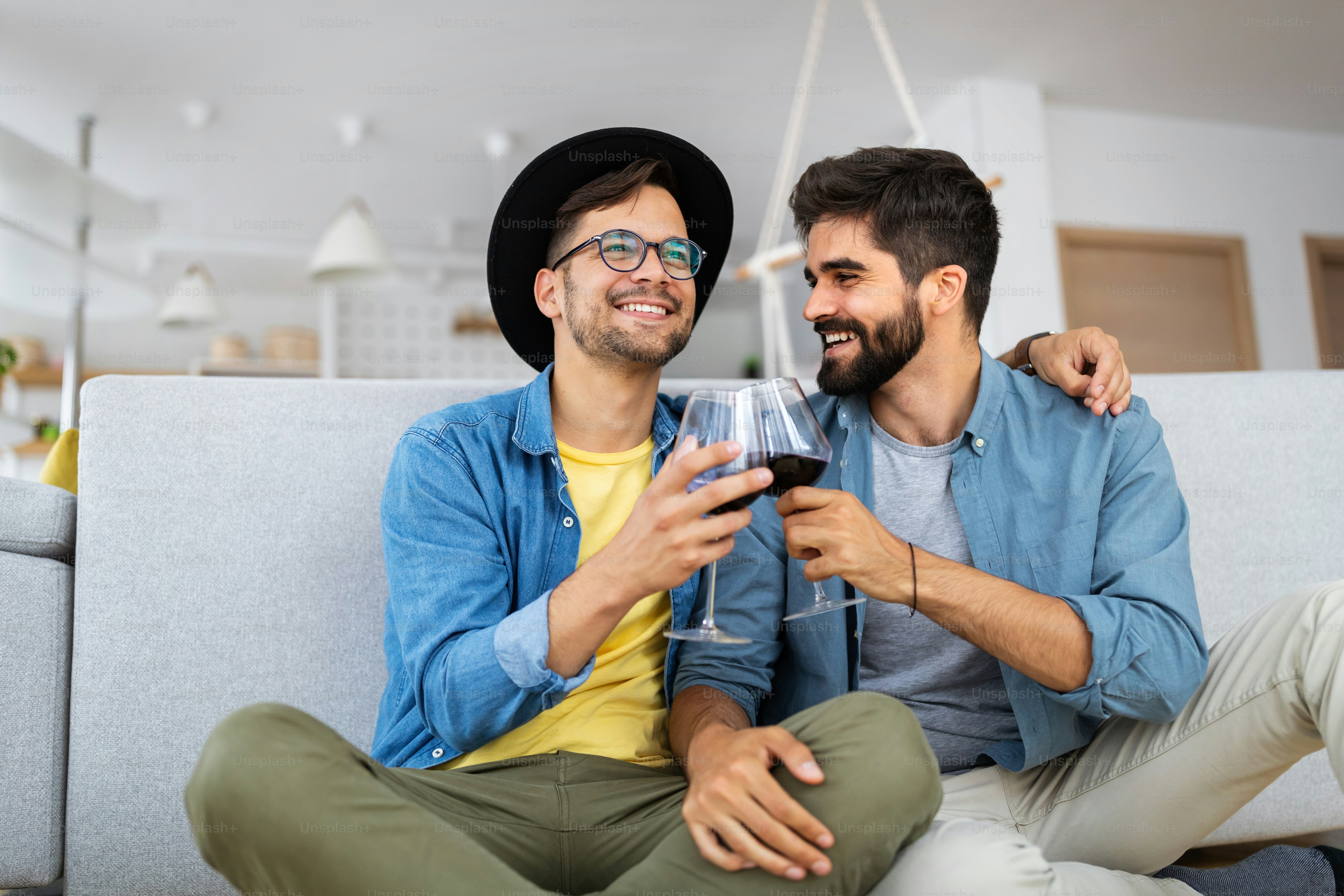 Happy homosexual male couple embraced, joking and having fun in an ...