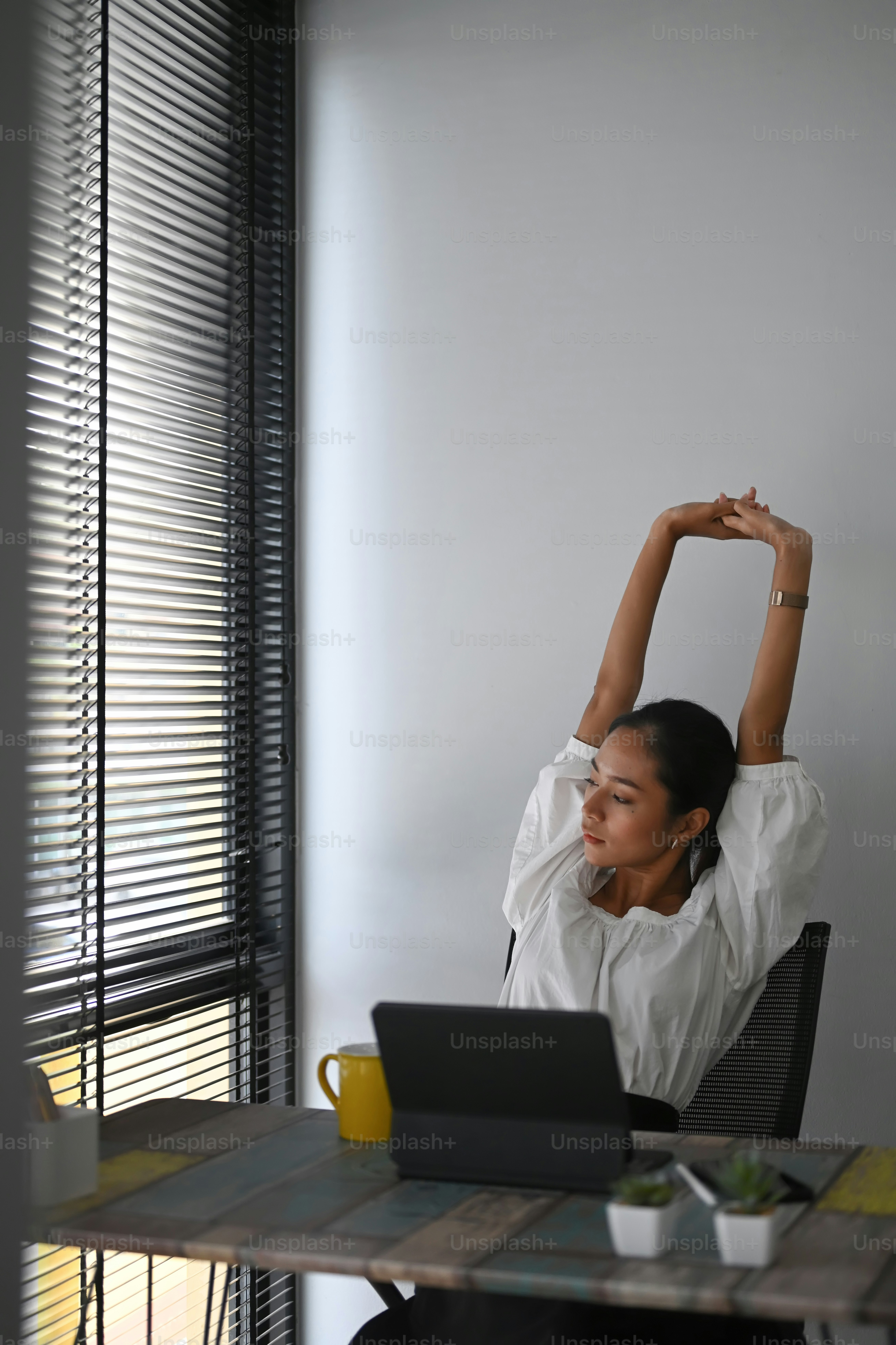 A calm businesswoman is relaxing and rest from computer feel stress ...