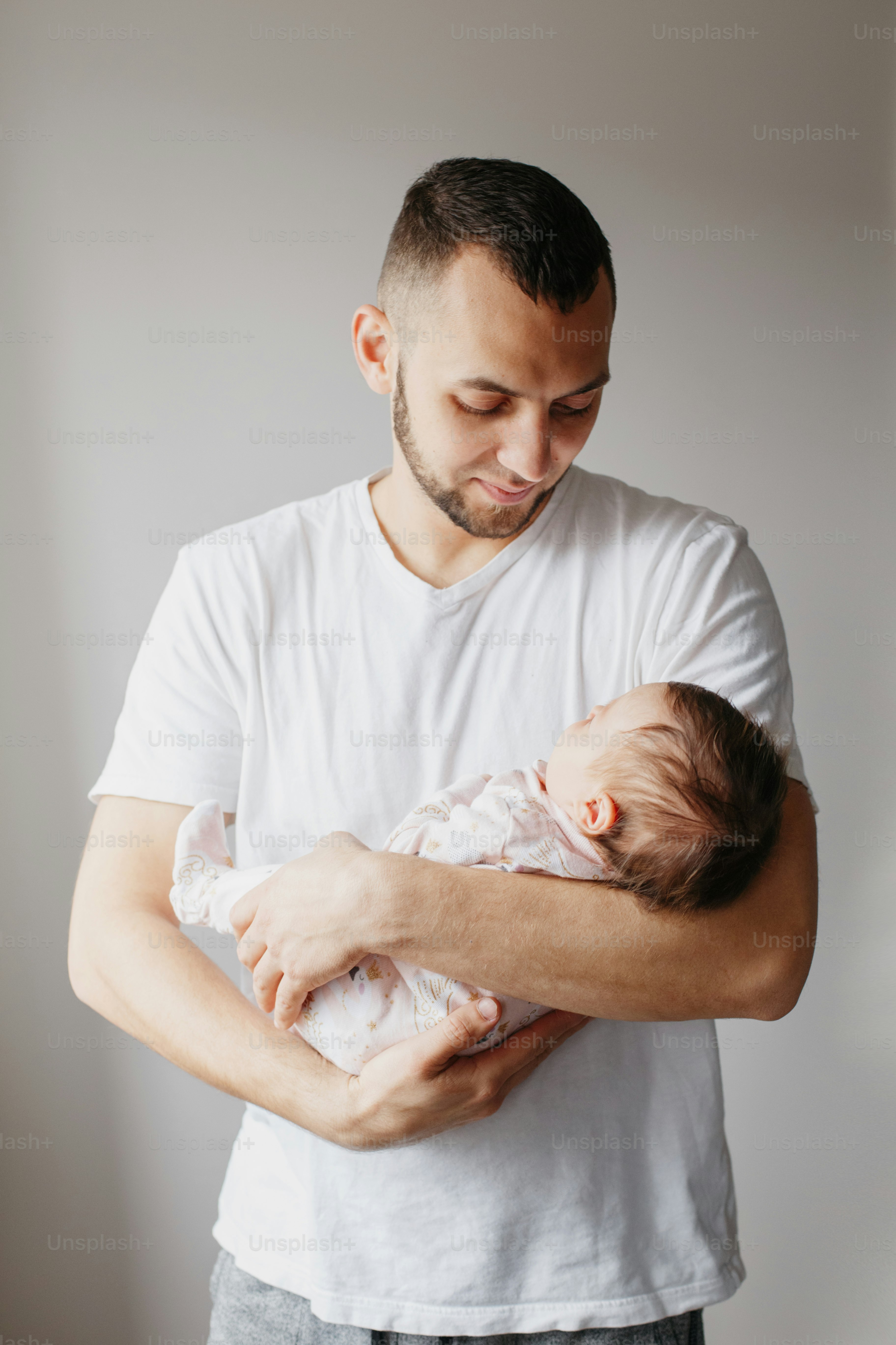 Man Carrying Baby
