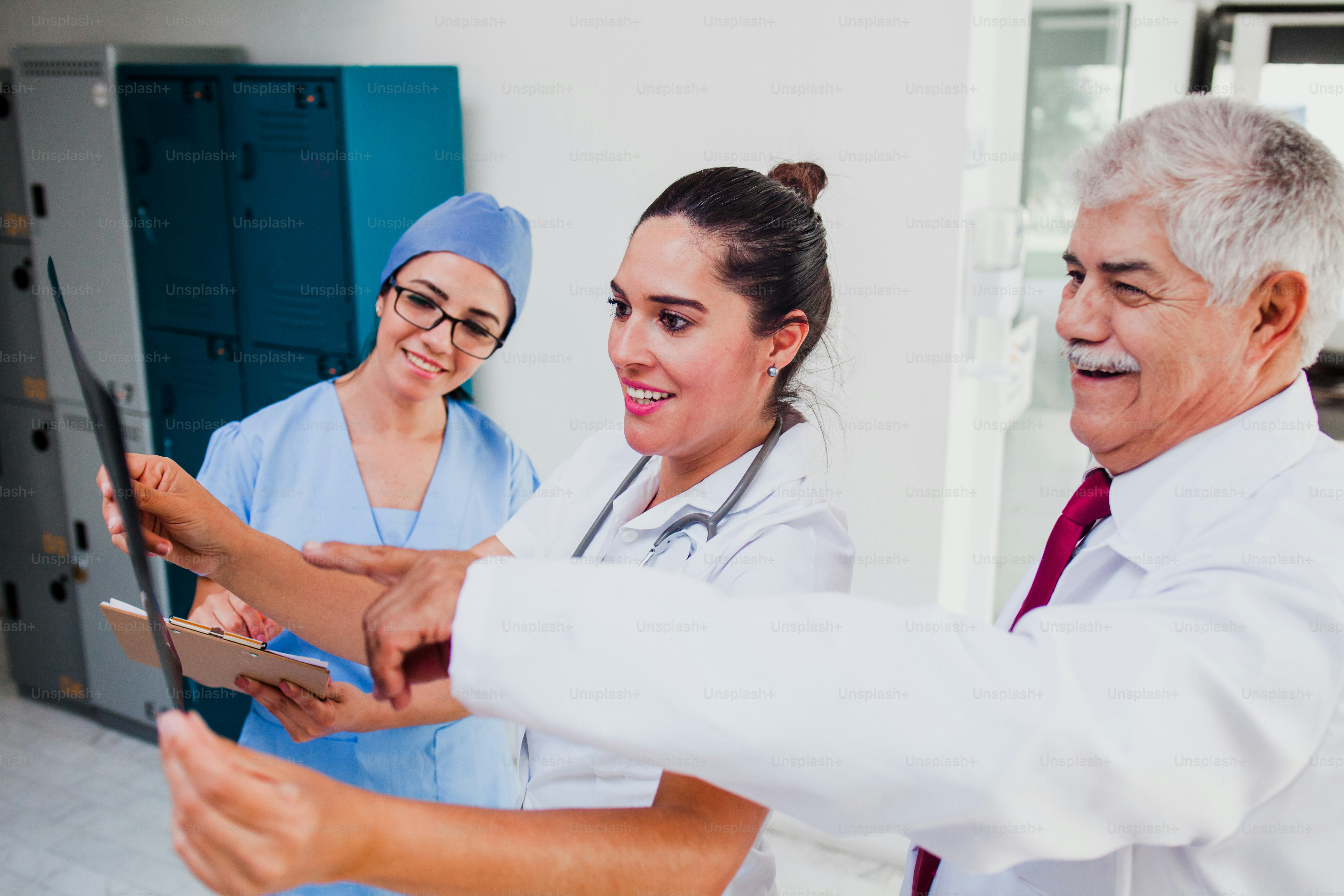 Group of latin doctors looking a radiography in a hospital photo ...
