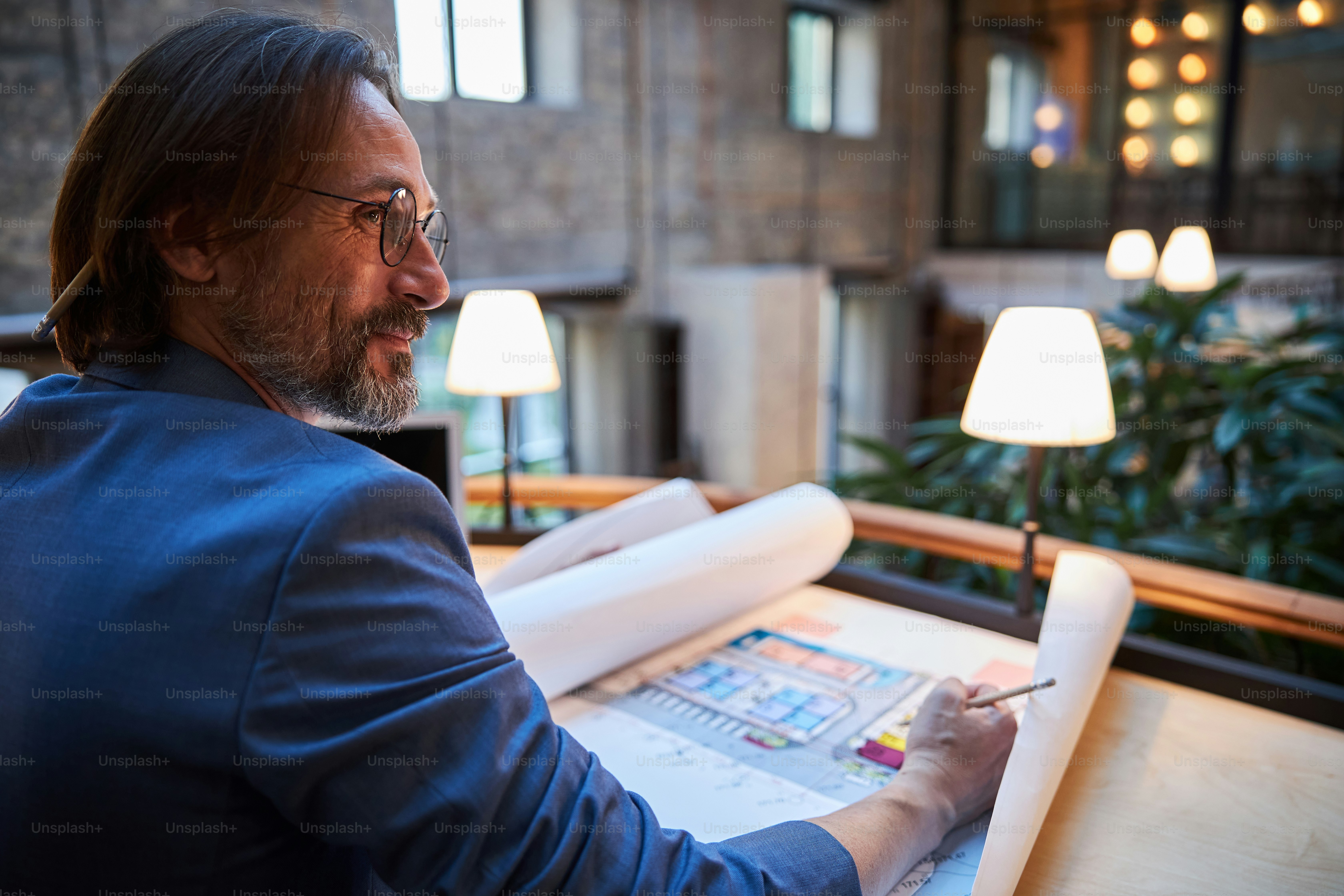 Shocked brunette man yelling with surprise while talking on the phone ...