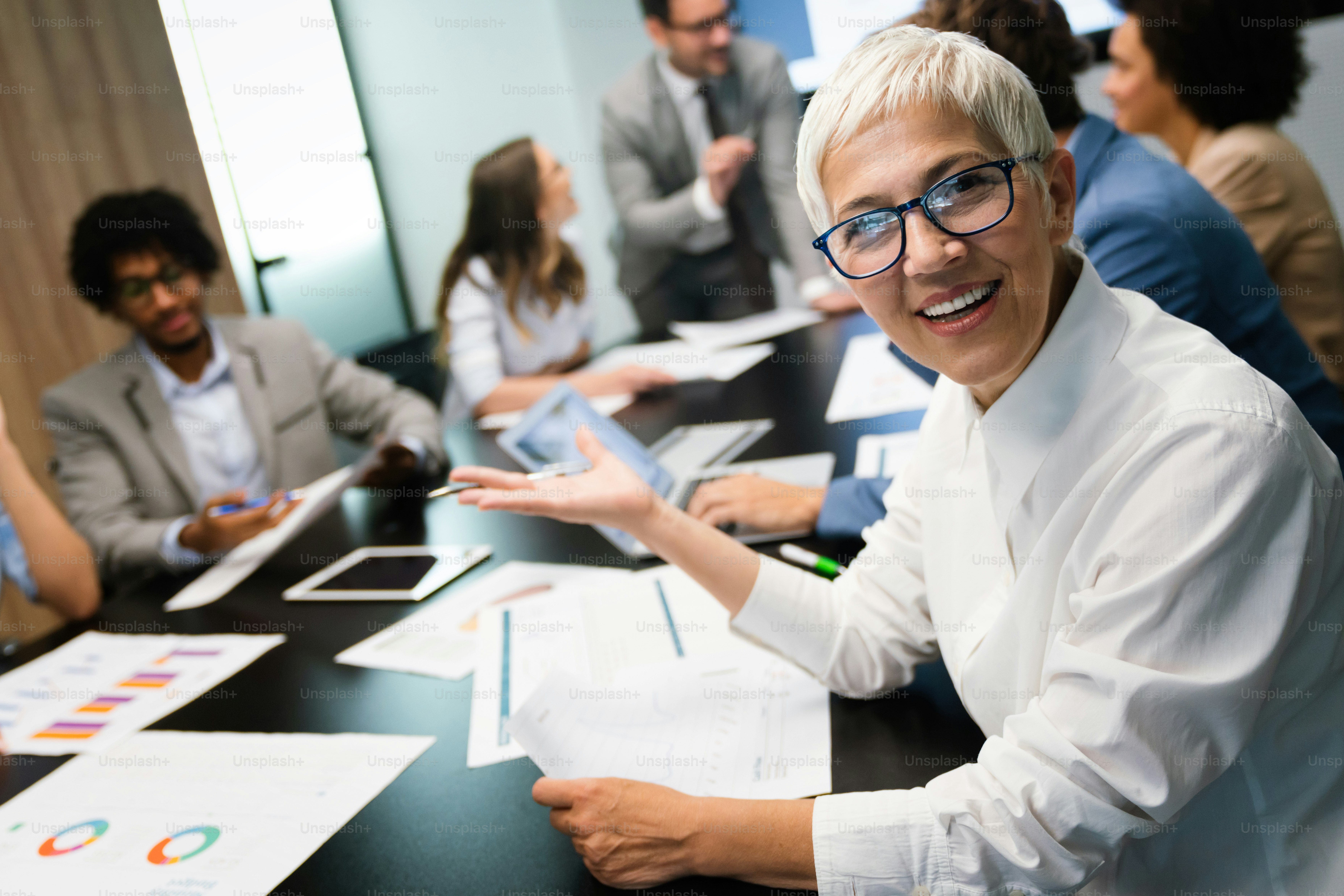 Portrait of architects, business people having discussion in office ...