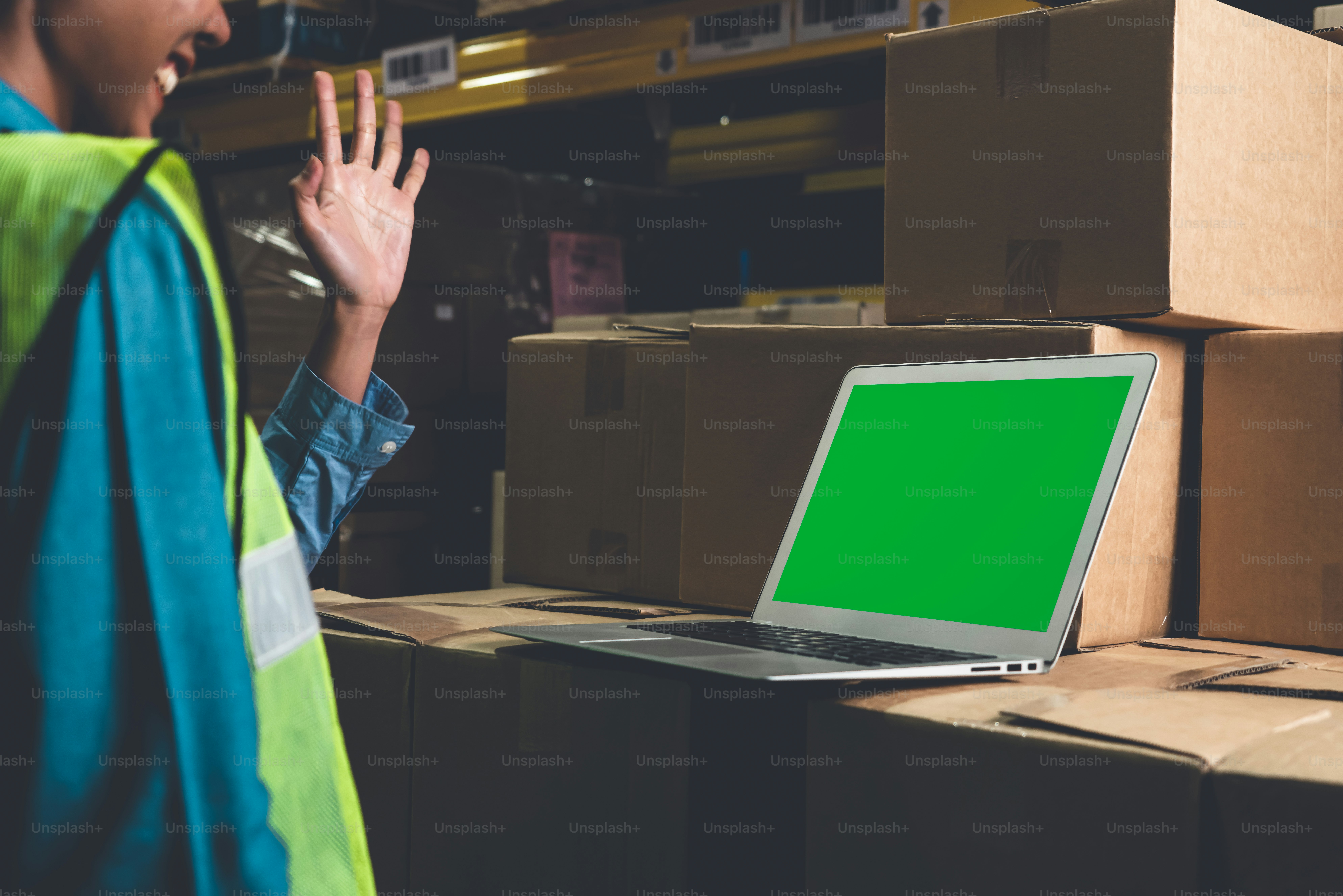 Computer with green screen display in warehouse storage room . Delivery ...