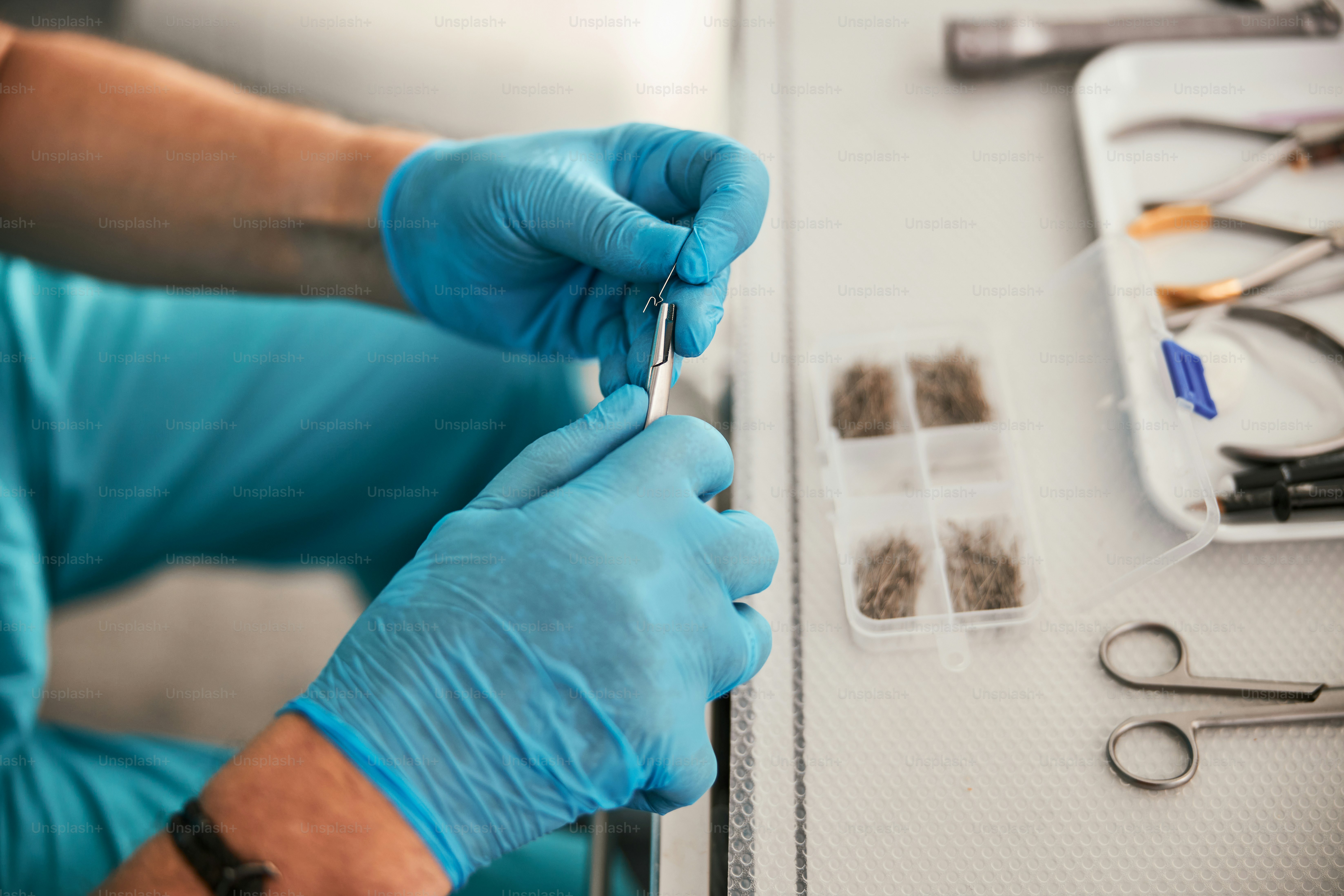 Close up portrait of doctor hands in blue gloves holding special ...