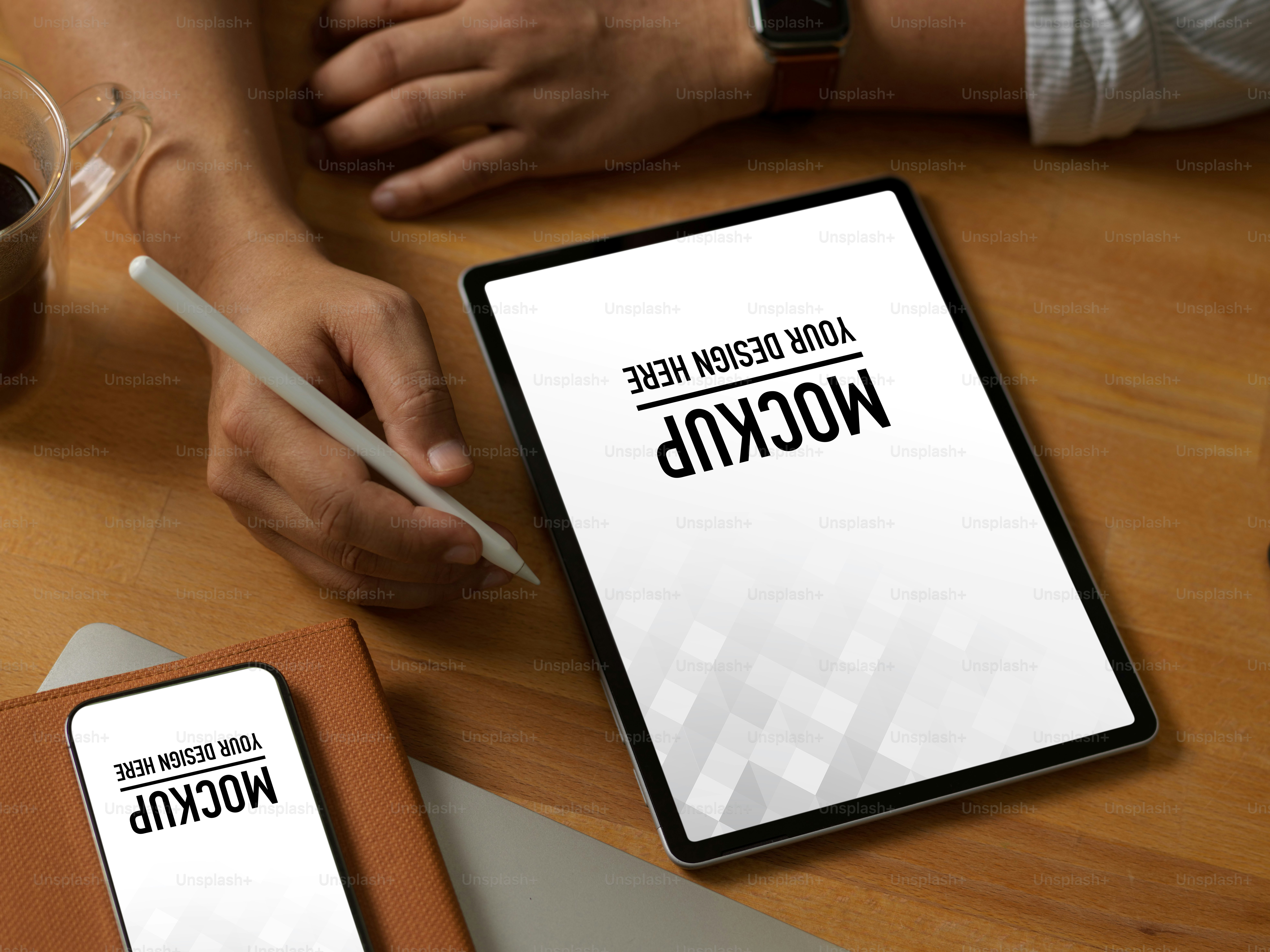 Top view of businessman using digital tablet on wooden table with ...