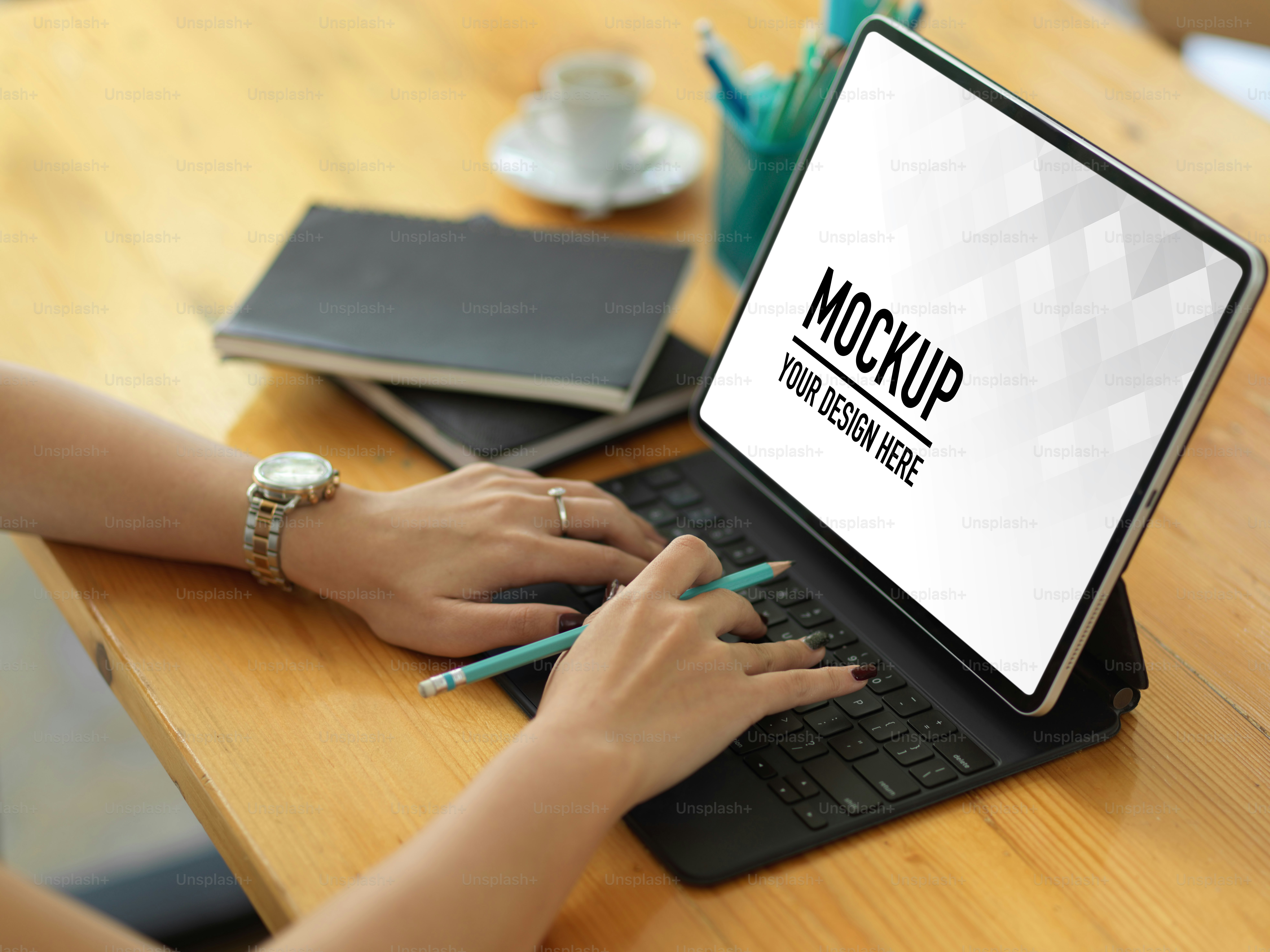 Cropped shot of female hands typing on tablet keyboard while working in ...