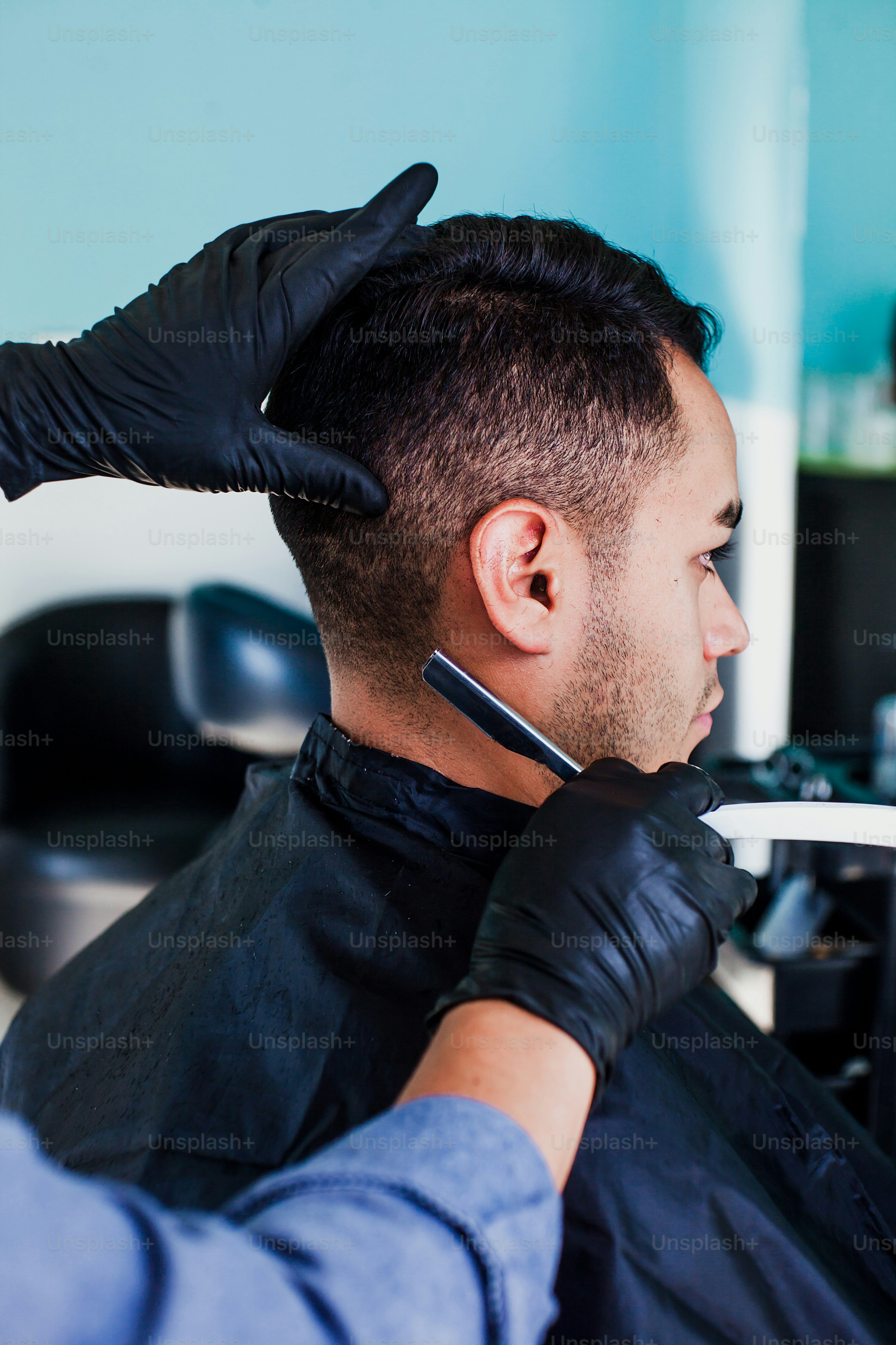 Latin man client getting haircut by hairdresser in Mexico city photo ...